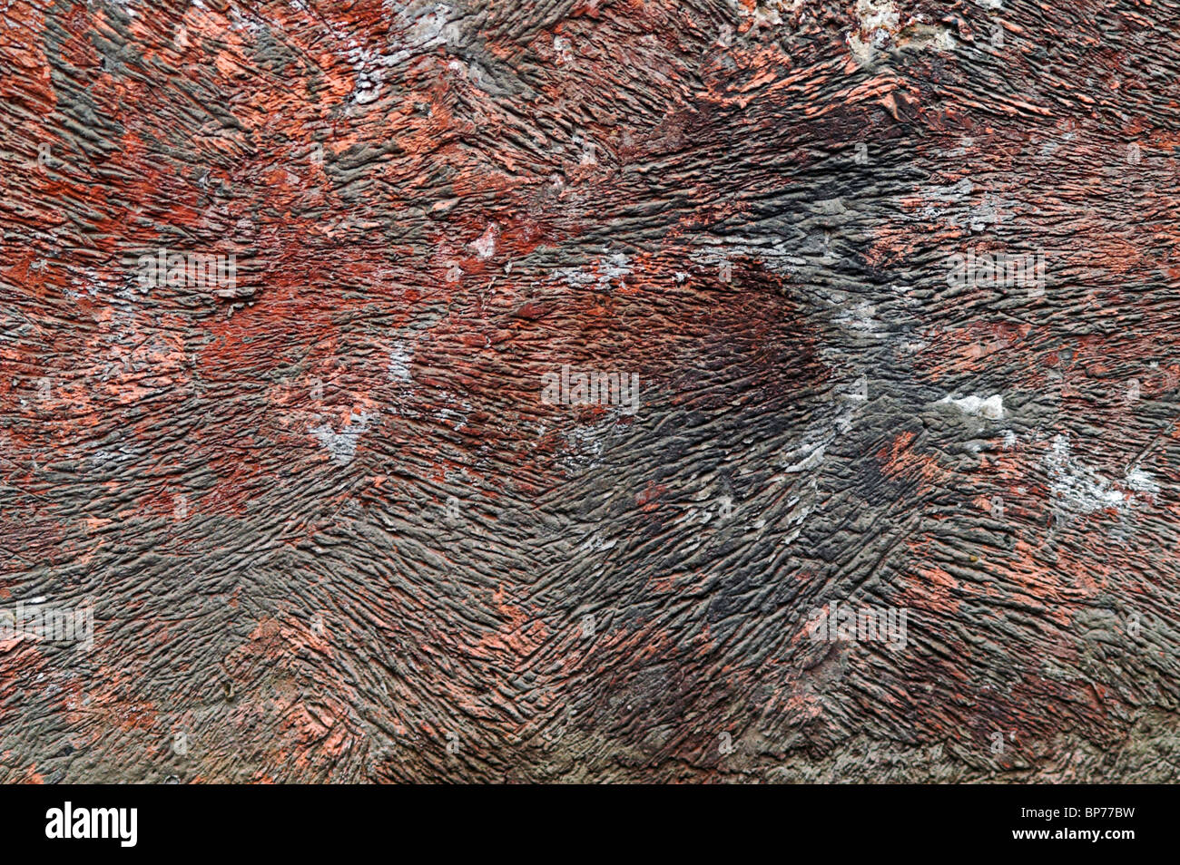 Red-colored corroded wall with surface ridges Stock Photo - Alamy
