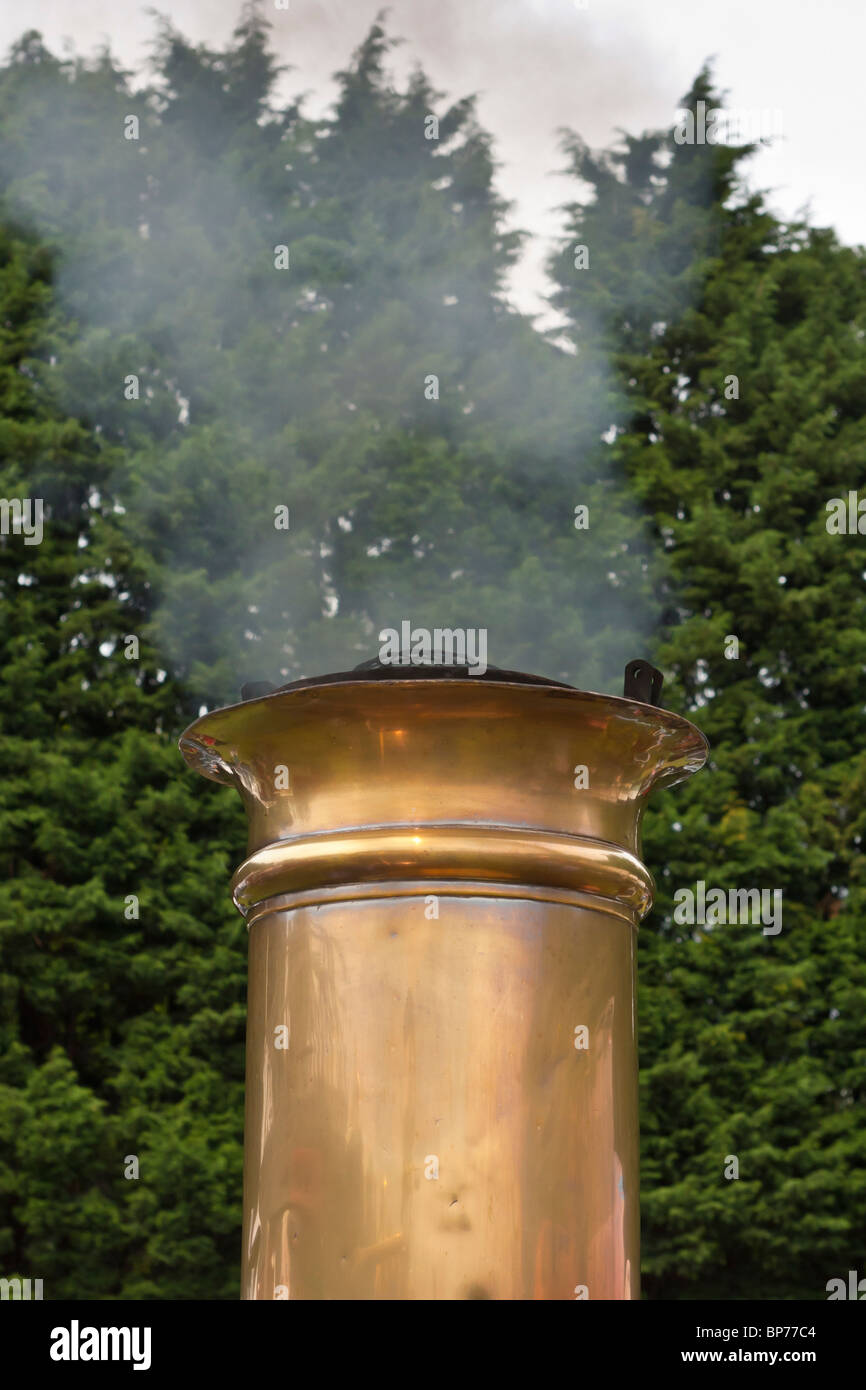 Brass chimney emitting steam Stock Photo - Alamy