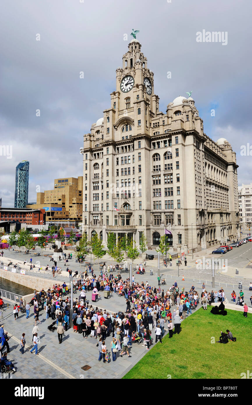 Men dressed as old ladies riding on Segways done up as shopping baskets ...