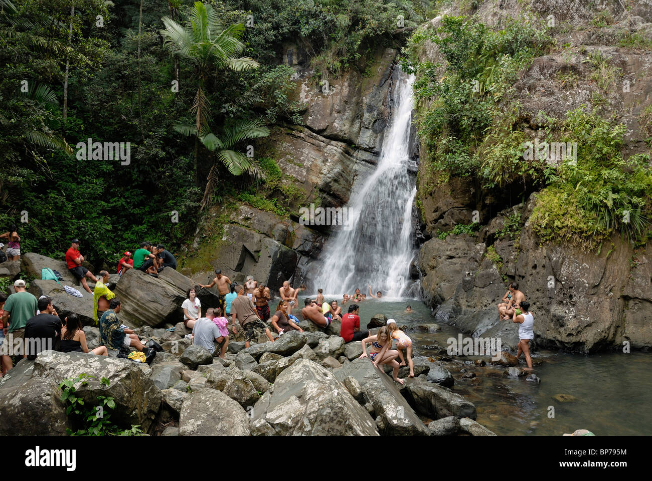 Tourists and locals mingle at La Mina waterfall, El Yunque rain forest ...