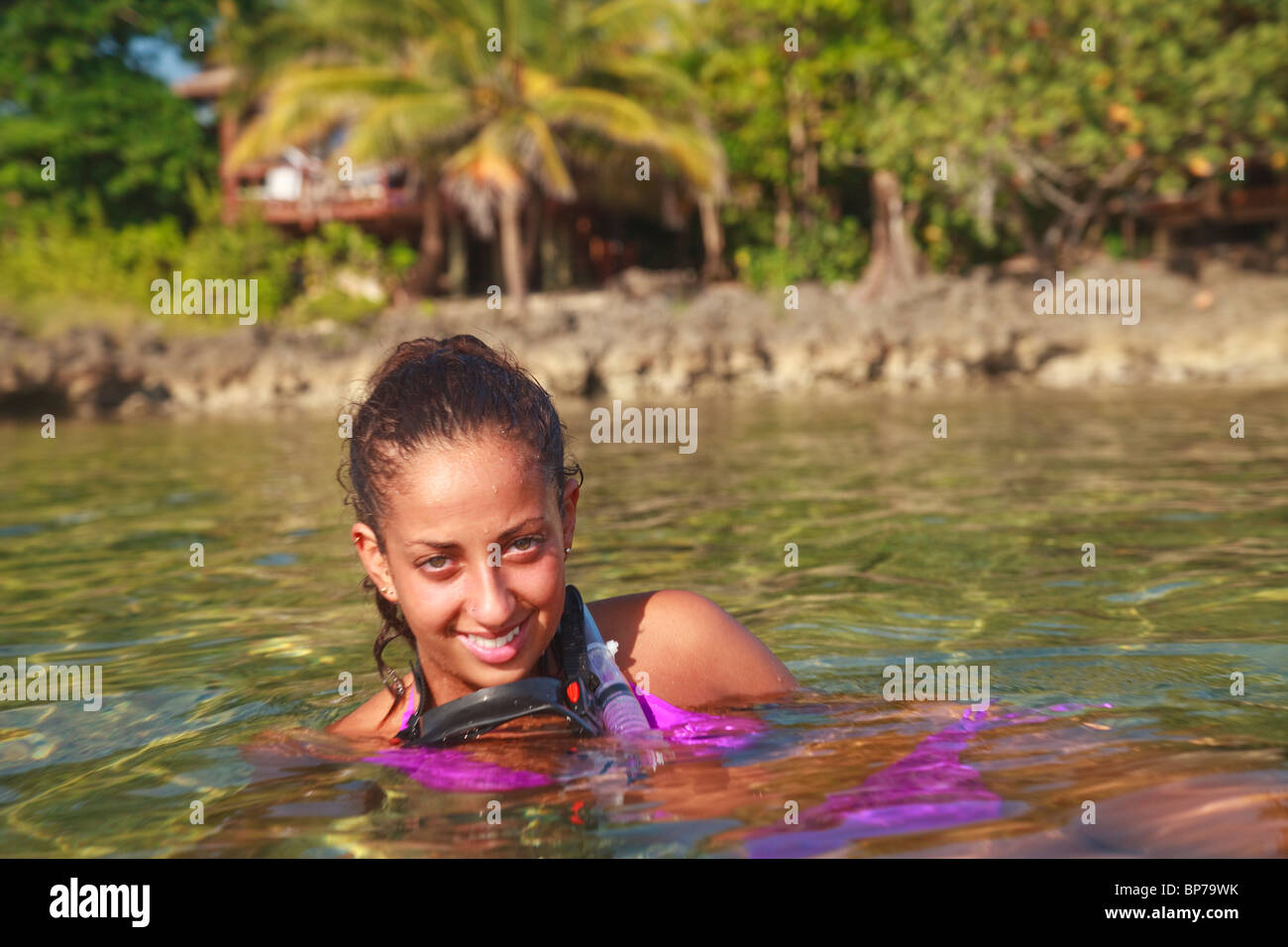 Roatan, Bay Islands, Honduras; A Young Woman With Snorkeling Gear At ...