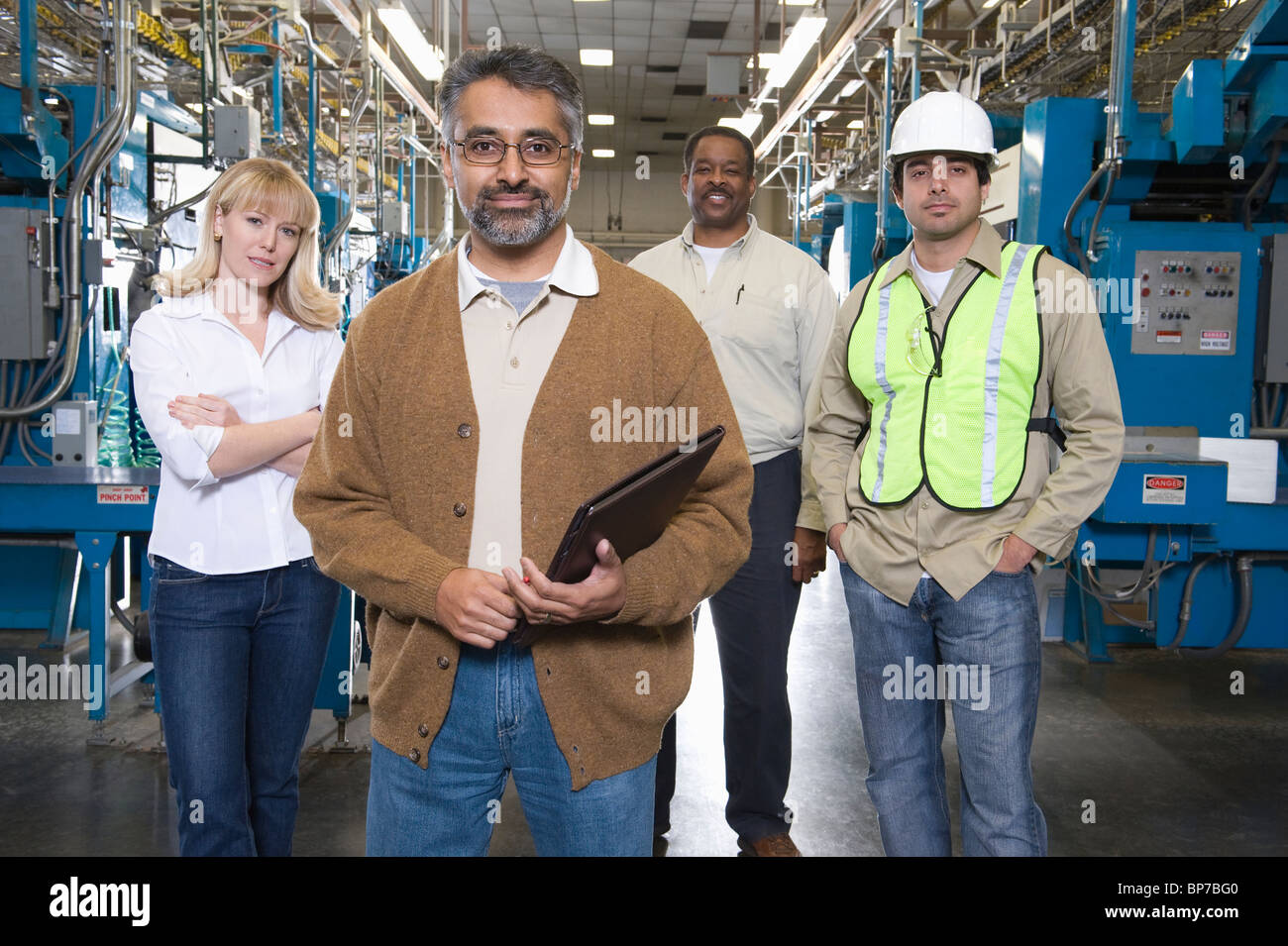 Group of people working in newspaper factory, portrait Stock Photo - Alamy