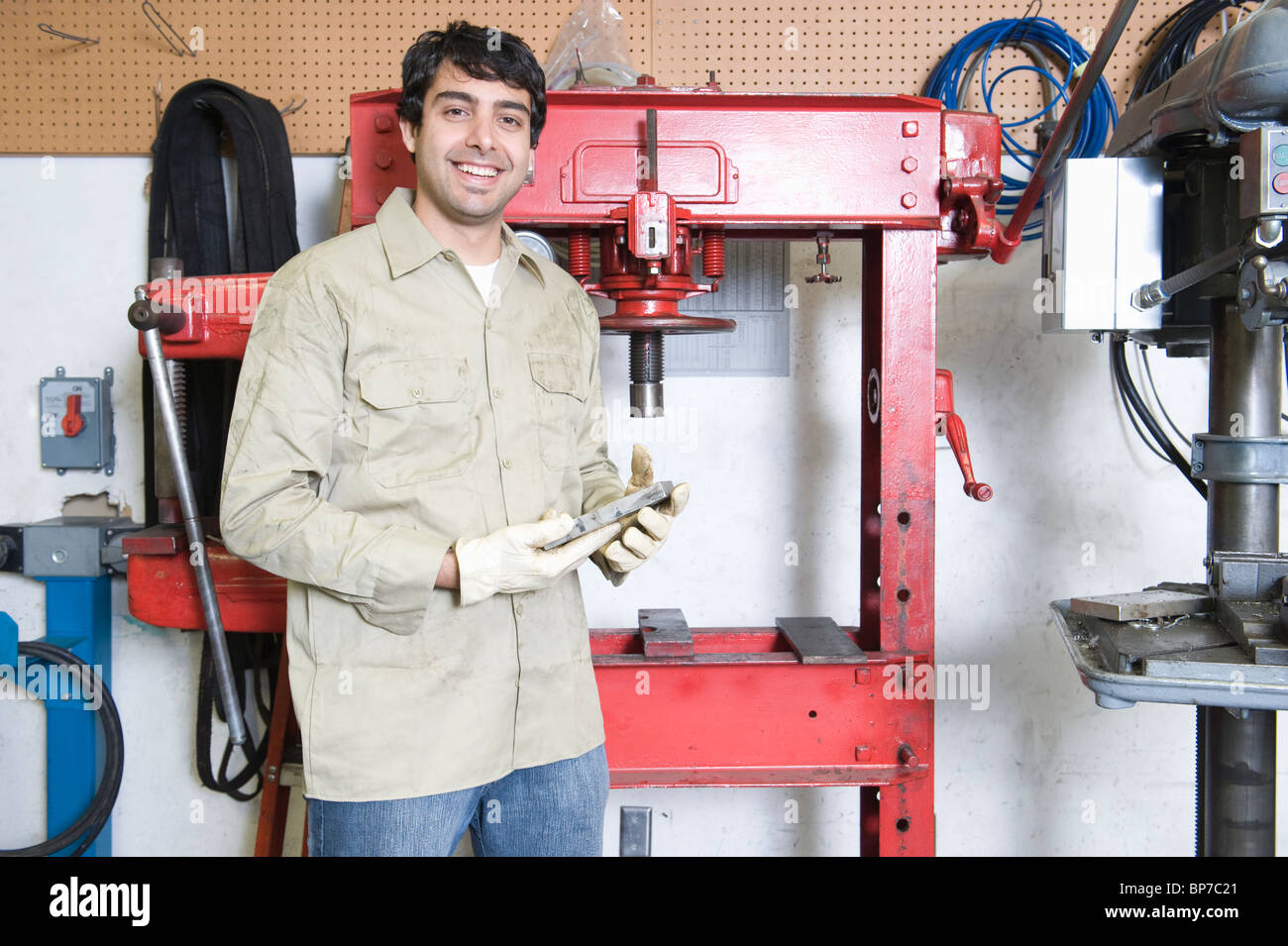 Man in workshop with tools Stock Photo - Alamy