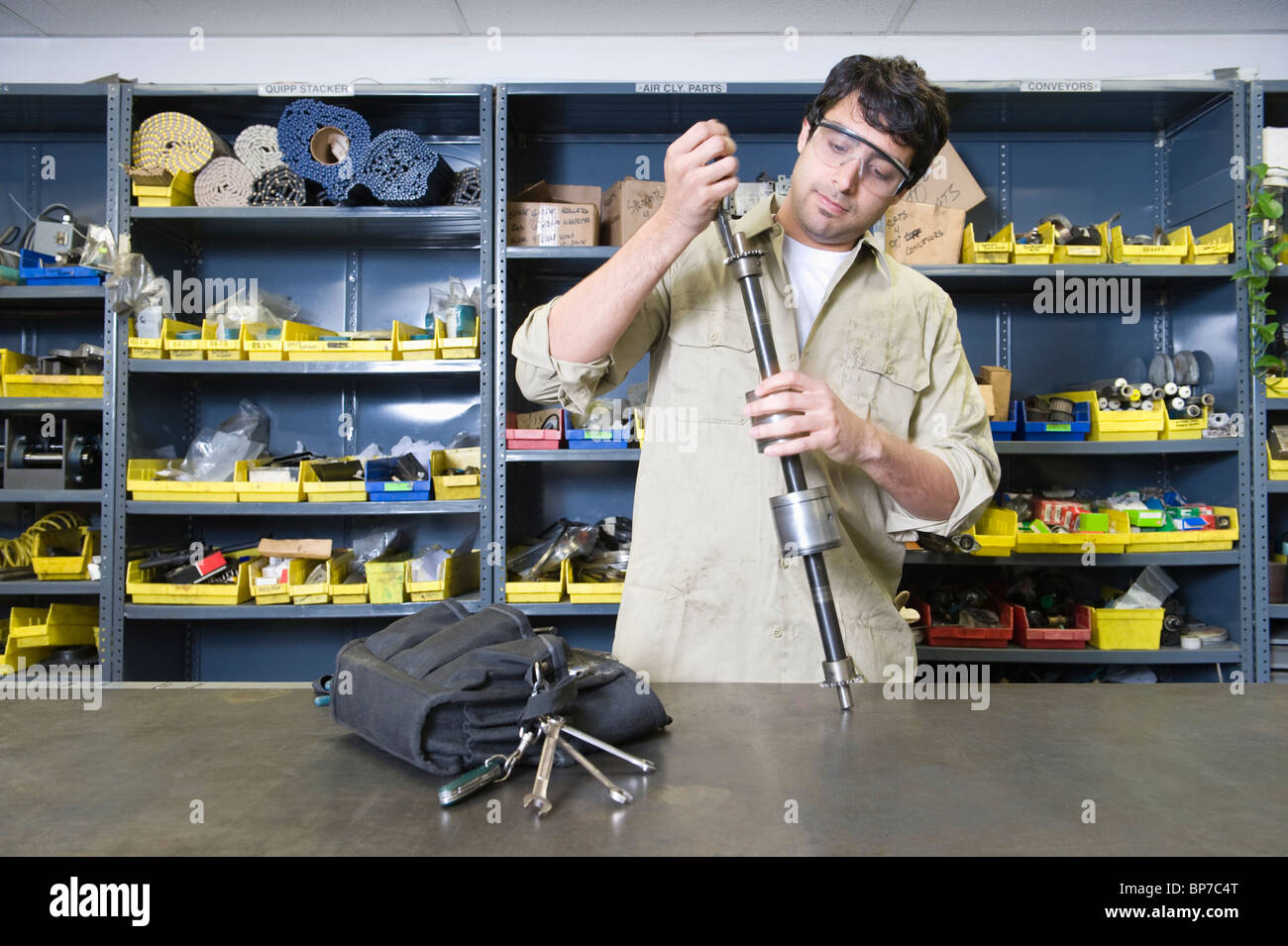 Man in workshop with tools Stock Photo - Alamy