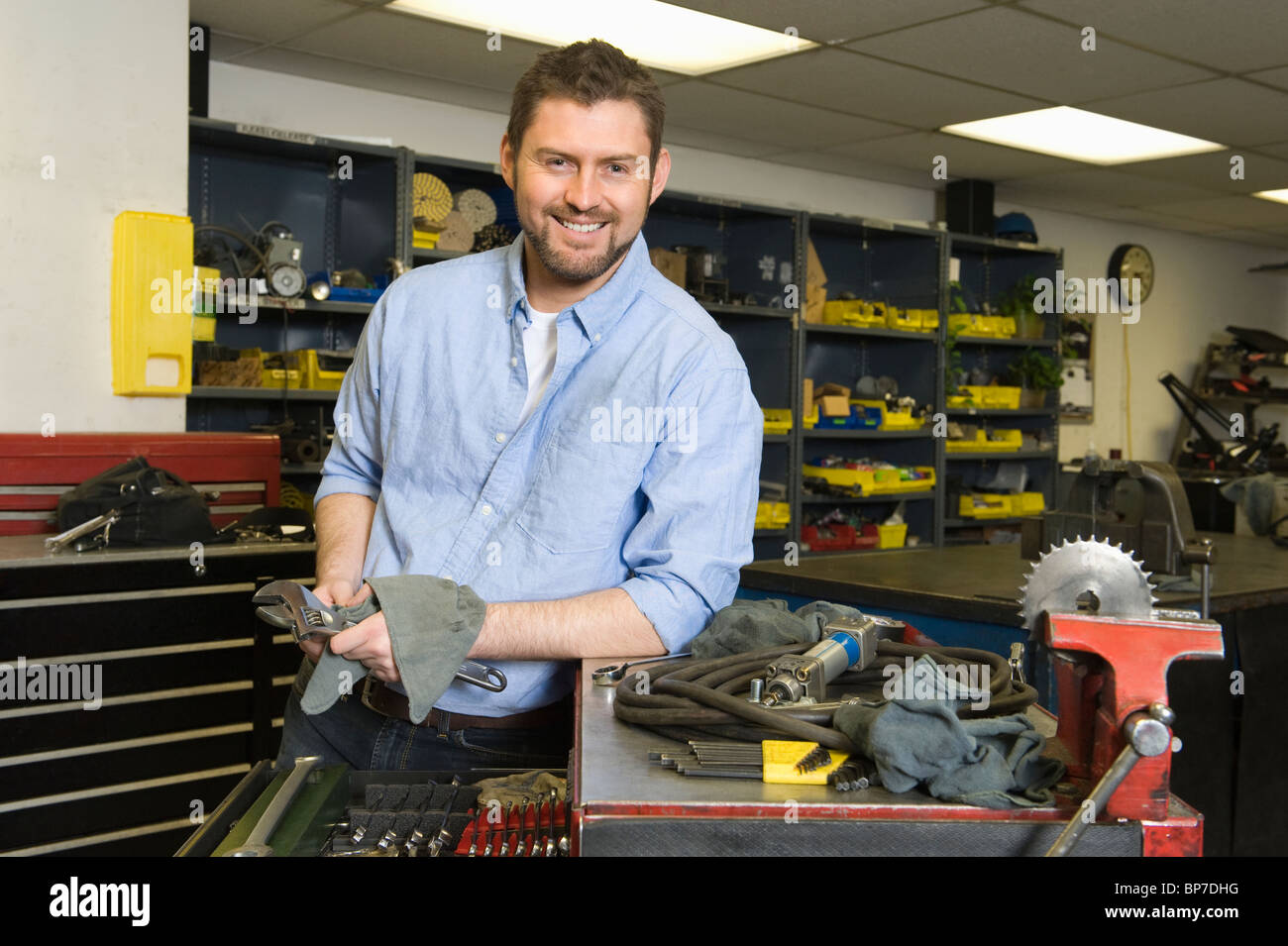 Man in workshop with tools Stock Photo - Alamy