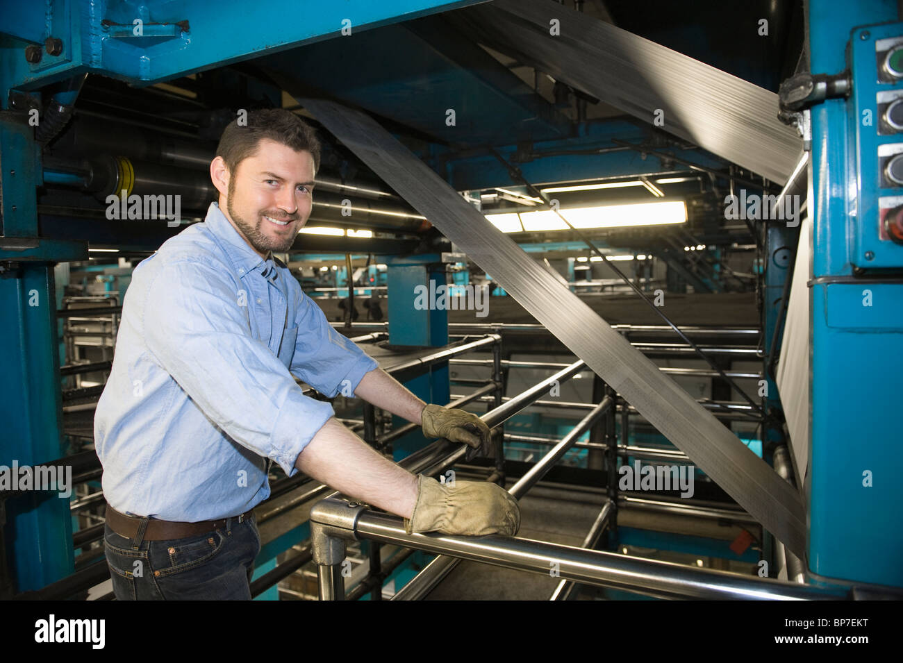 Man working in newspaper factory Stock Photo - Alamy