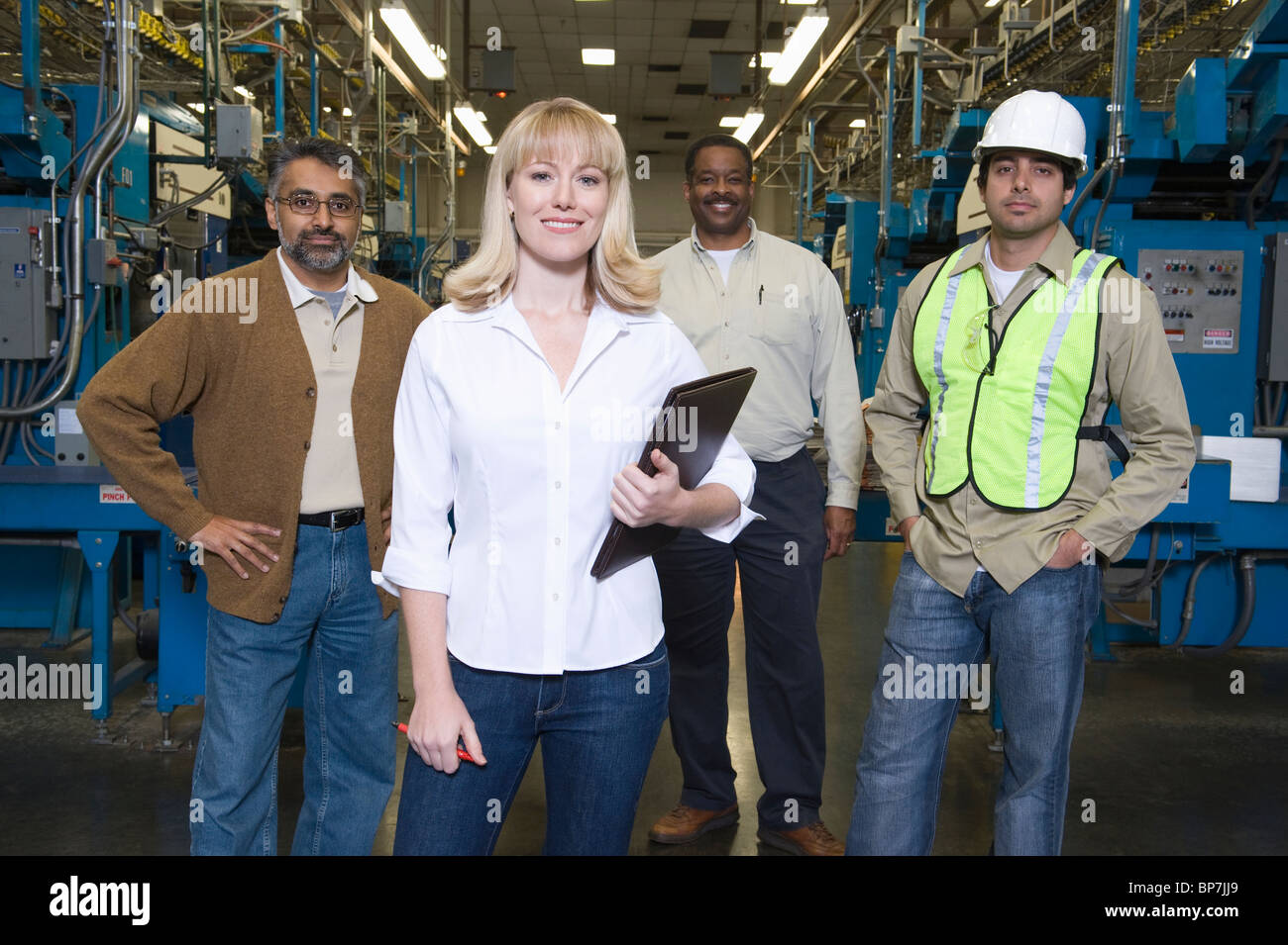 Group of people working in newspaper factory, portrait Stock Photo - Alamy