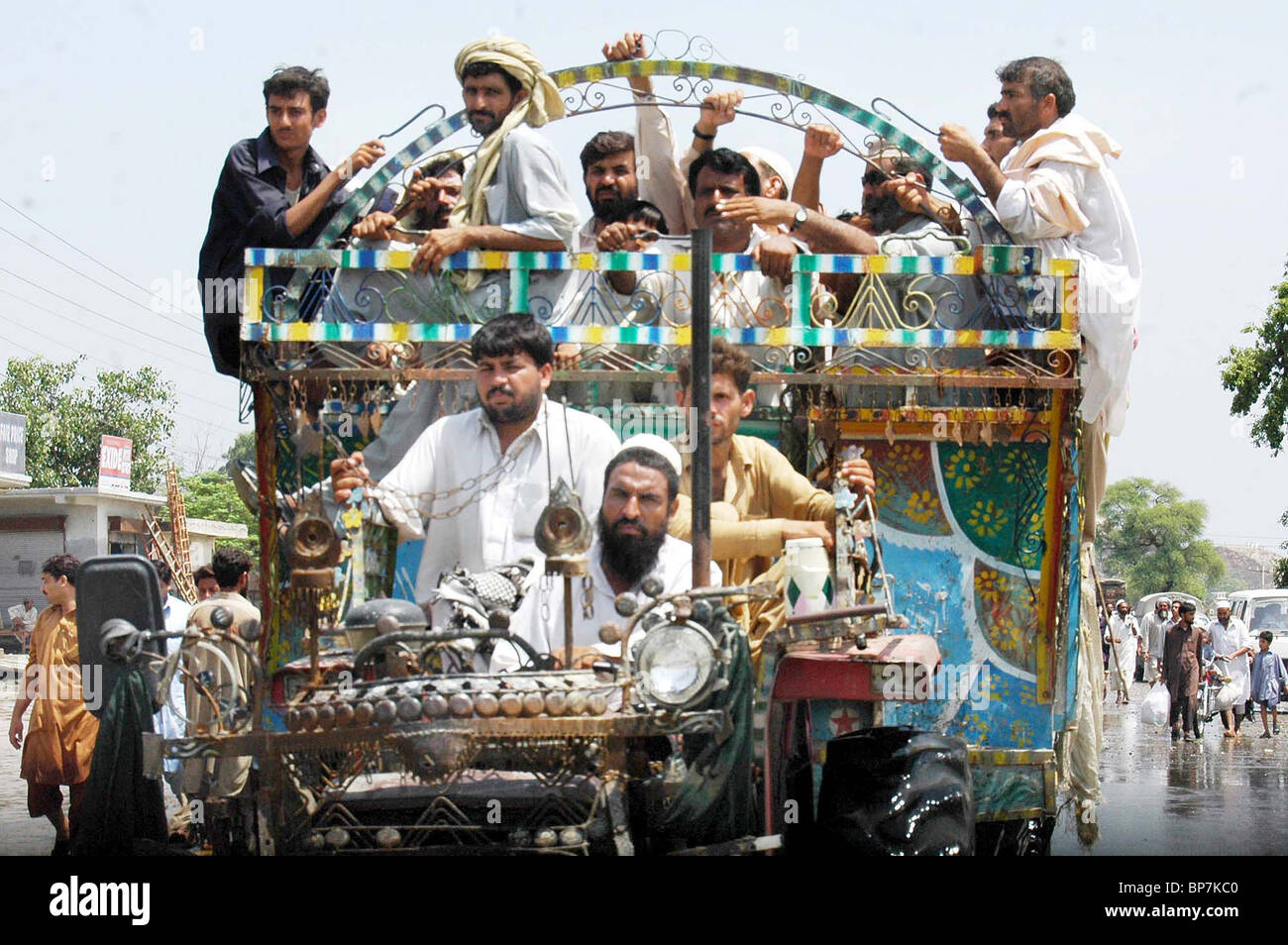 Flood affectees travel as they are moving towards safe place after ...