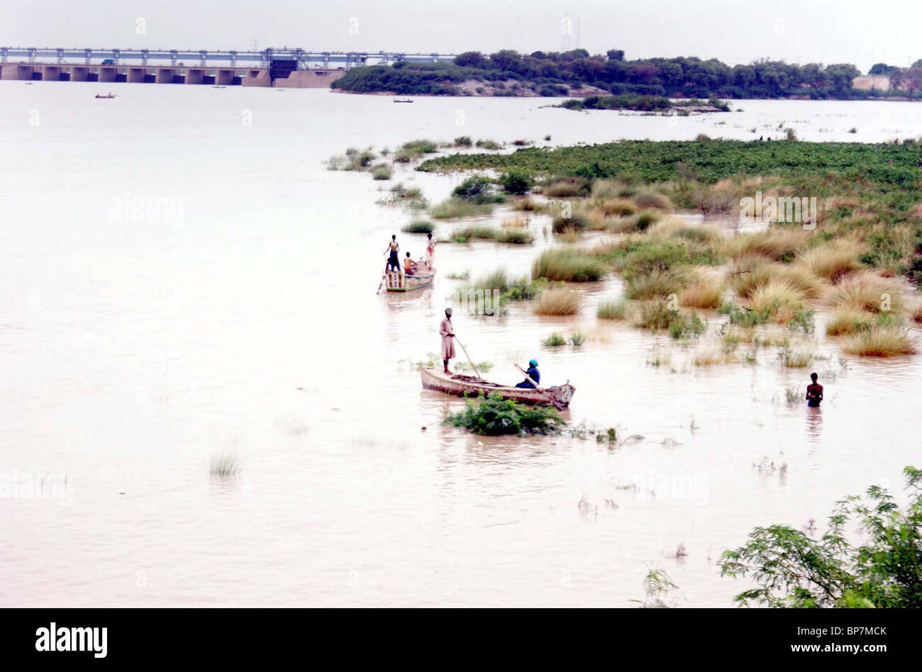 Irrigation department officials patrol at Indus River after flood ...