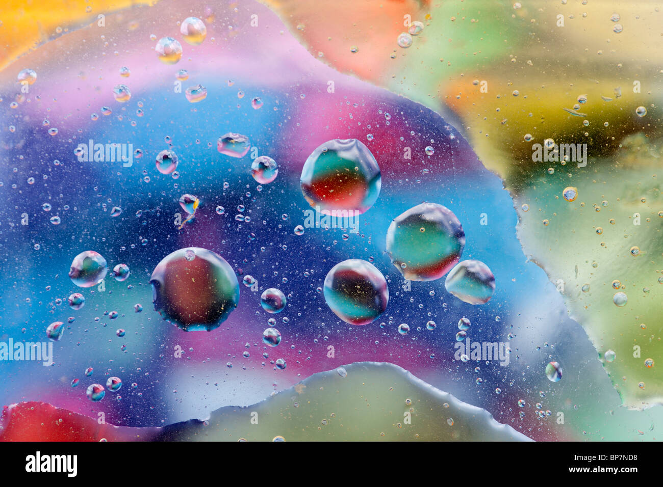 Oil drops on water Stock Photo - Alamy