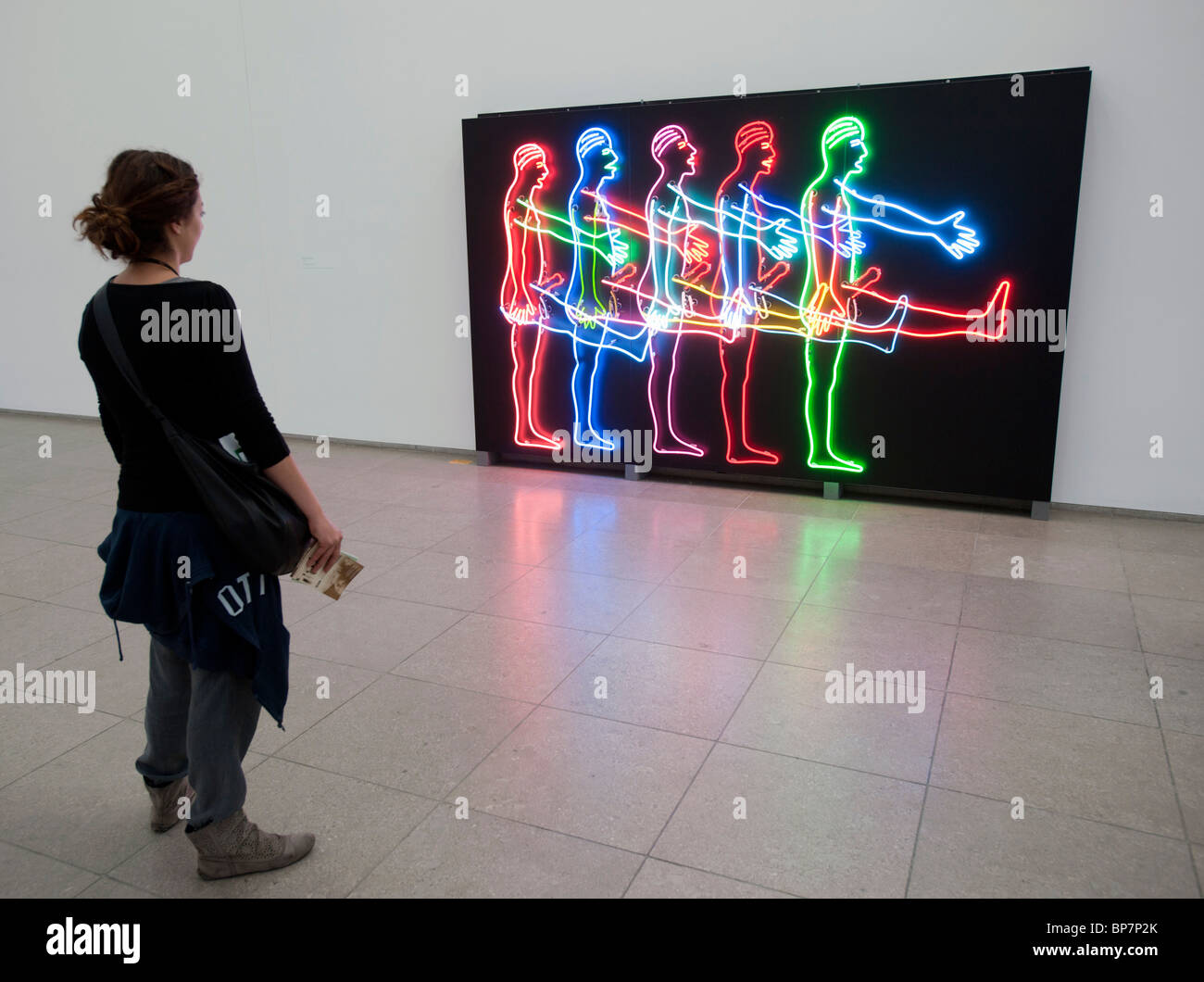Light installation sculpture by Bruce Nauman titled Five Marching Men ...