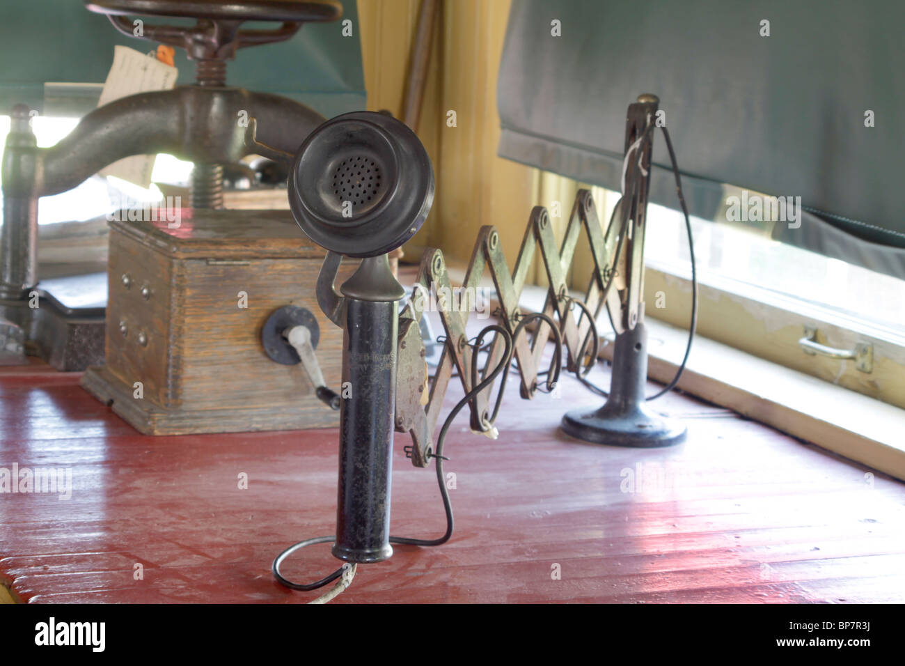 Old fashion telephone on scissors extender in railroad office Stock ...