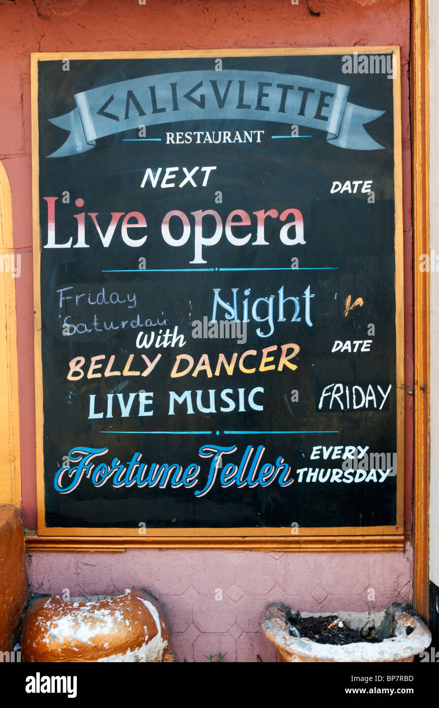 Sign advertising Live Opera, Belly Dancing and a Fortune Teller outside ...