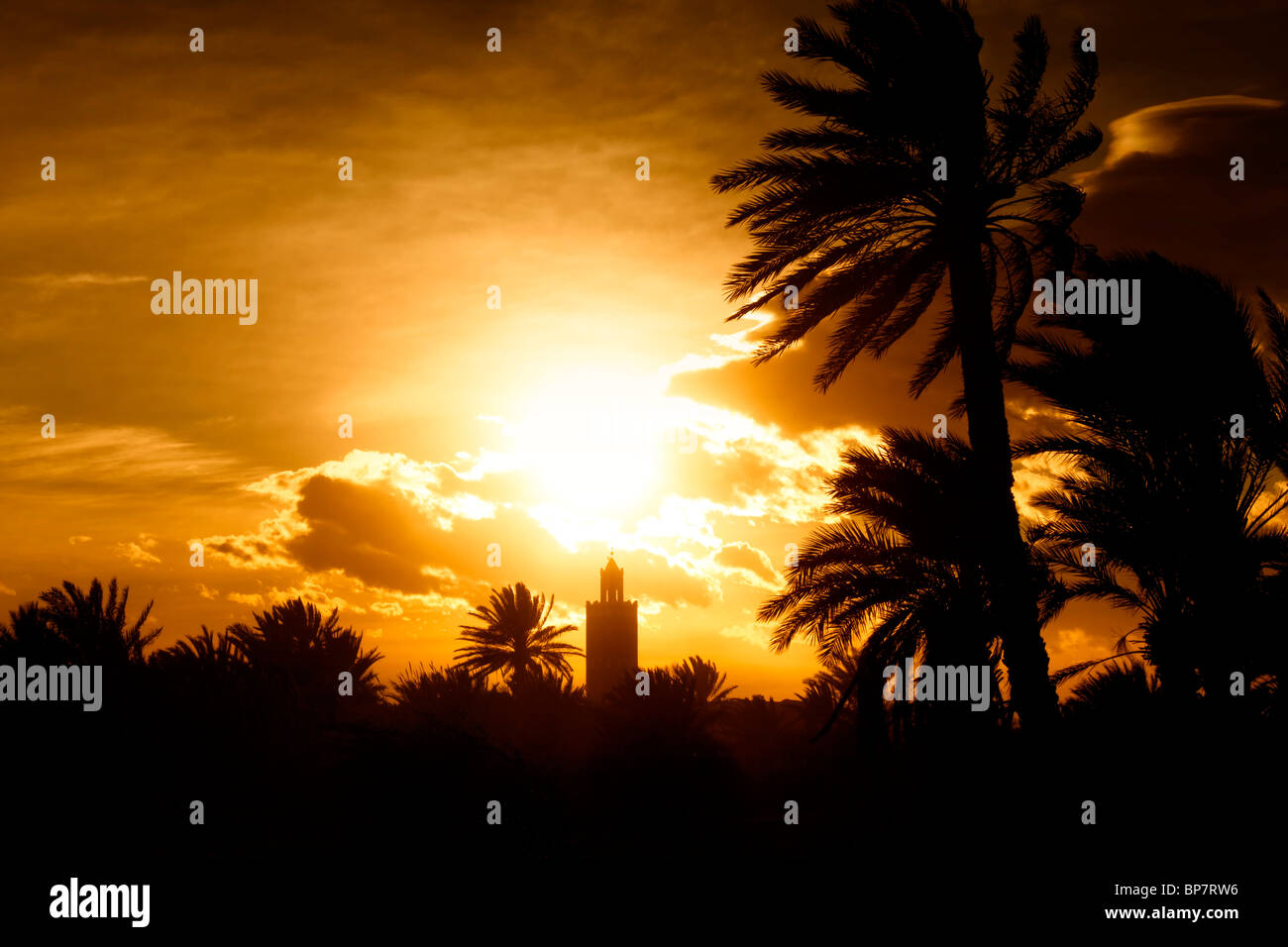 Minaret of a mosque at sunset Stock Photo - Alamy