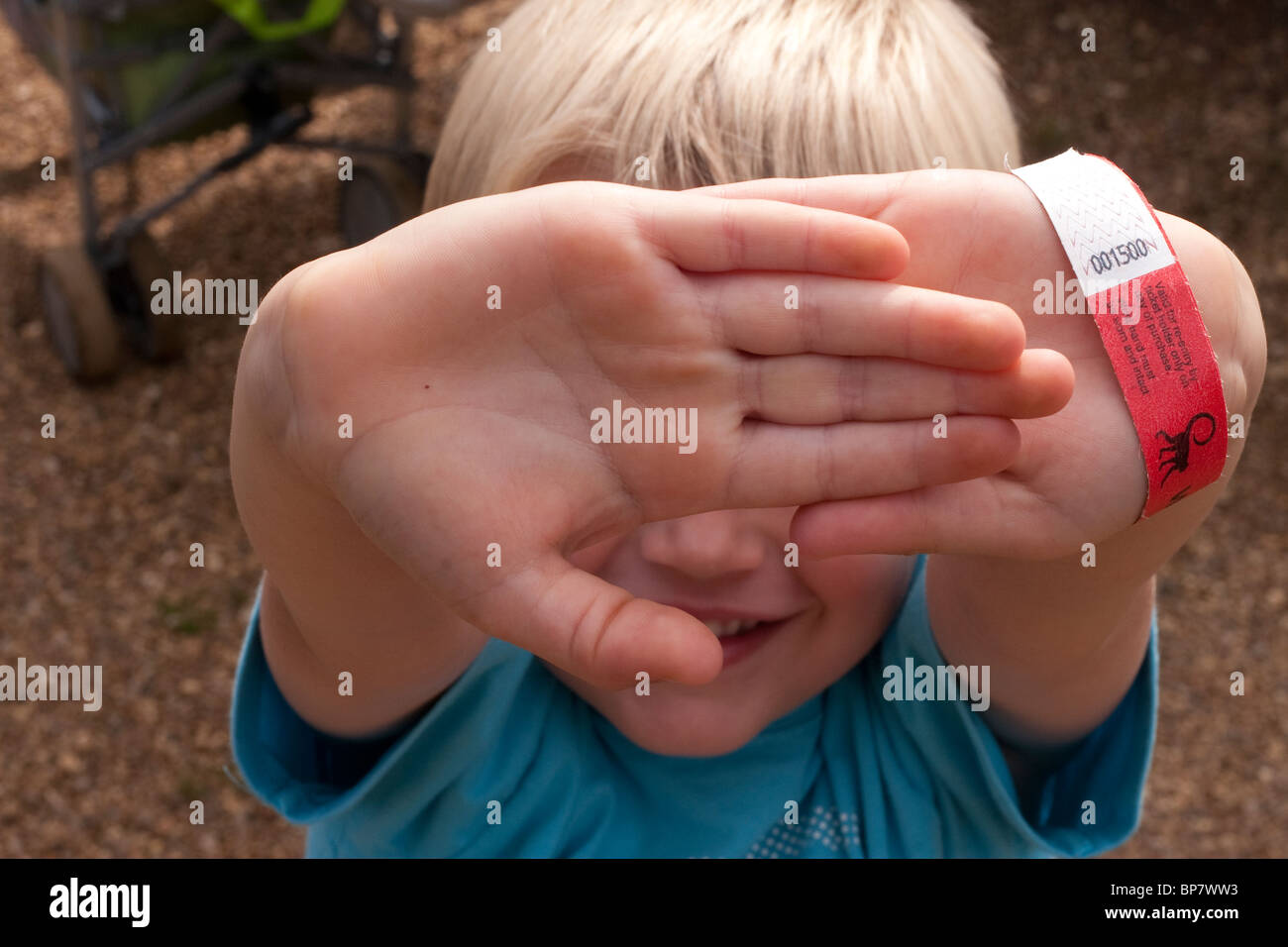 A child refusing to have his picture taken Stock Photo - Alamy