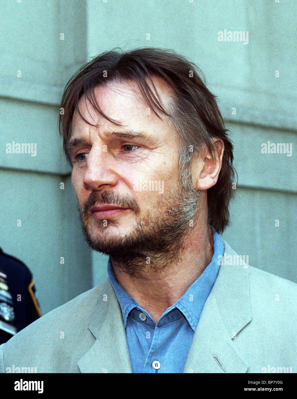 The actor Liam Neeson distributes tickets to the officers for a charity ...