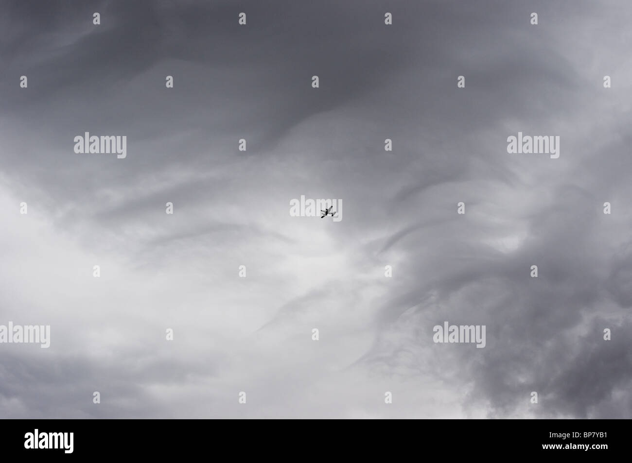 Airplane flying through storm clouds over Mexico Stock Photo - Alamy