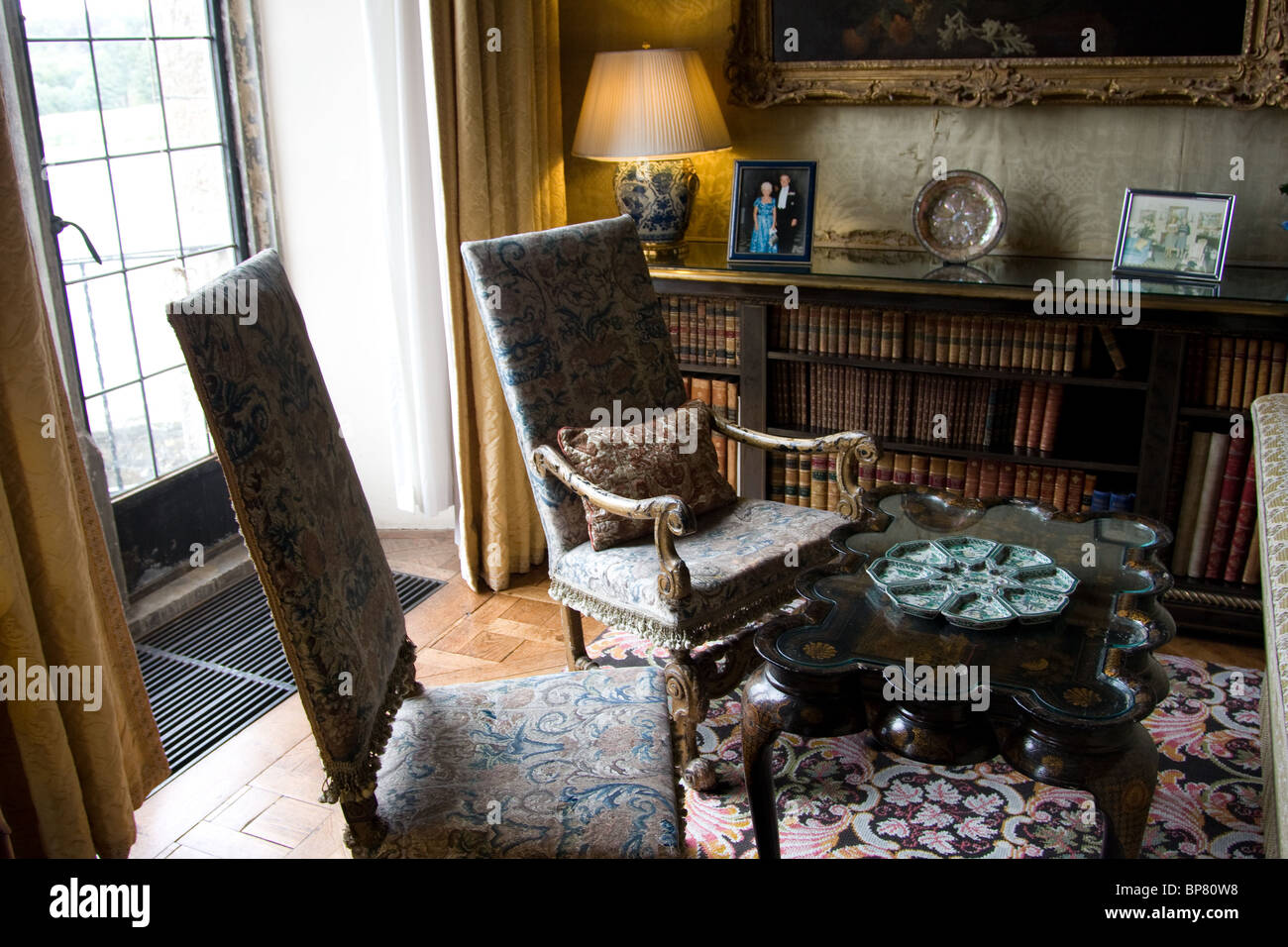 country house room traditional table books chairs Stock Photo - Alamy