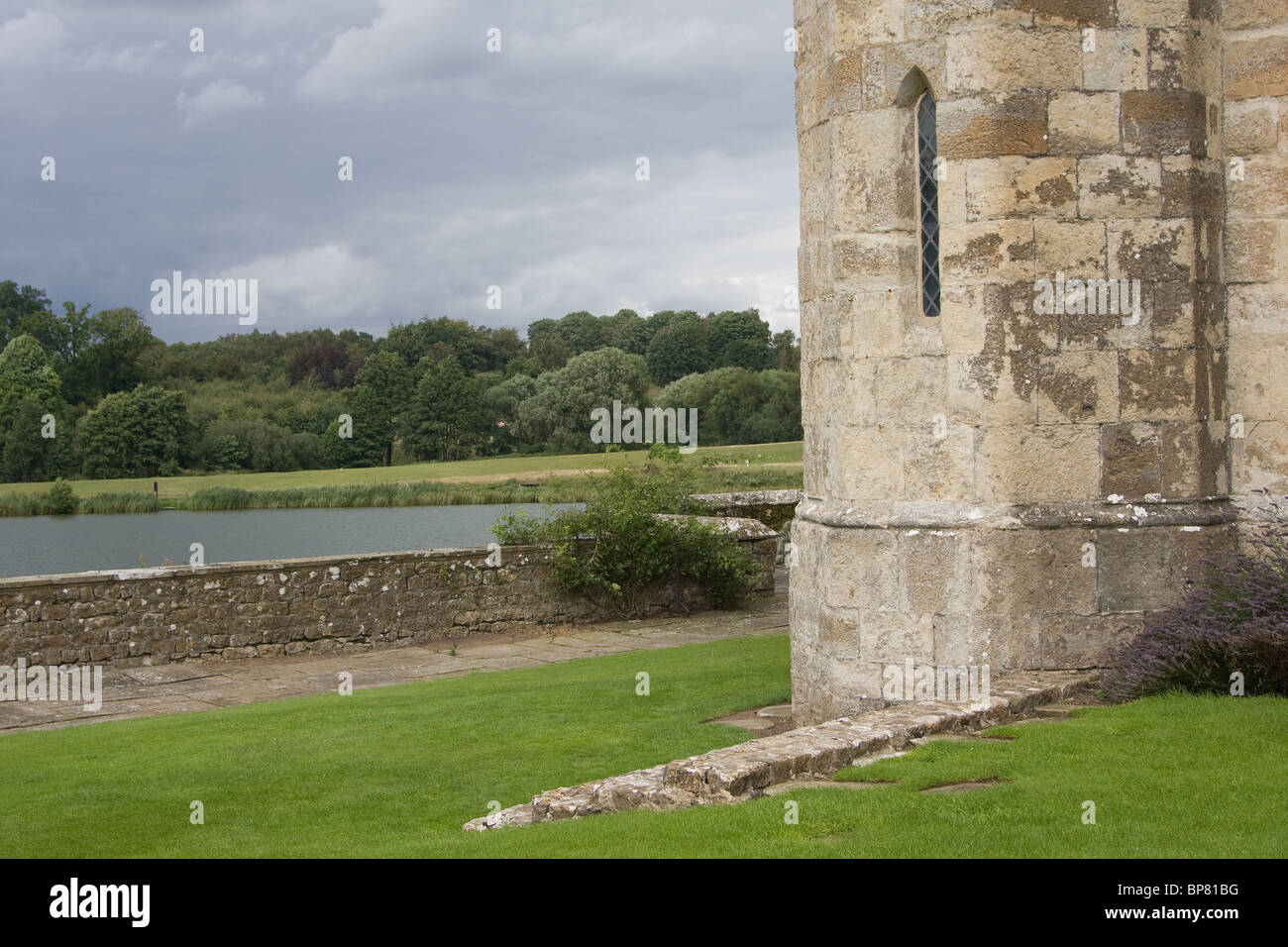 front castle country house seat turrets path lake Stock Photo - Alamy