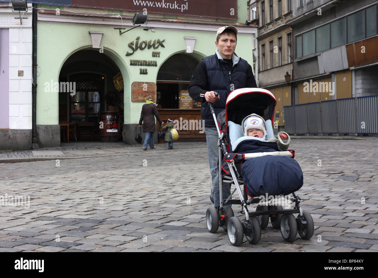 A father with his baby in the Old Town, Poznan, Poland Stock Photo - Alamy