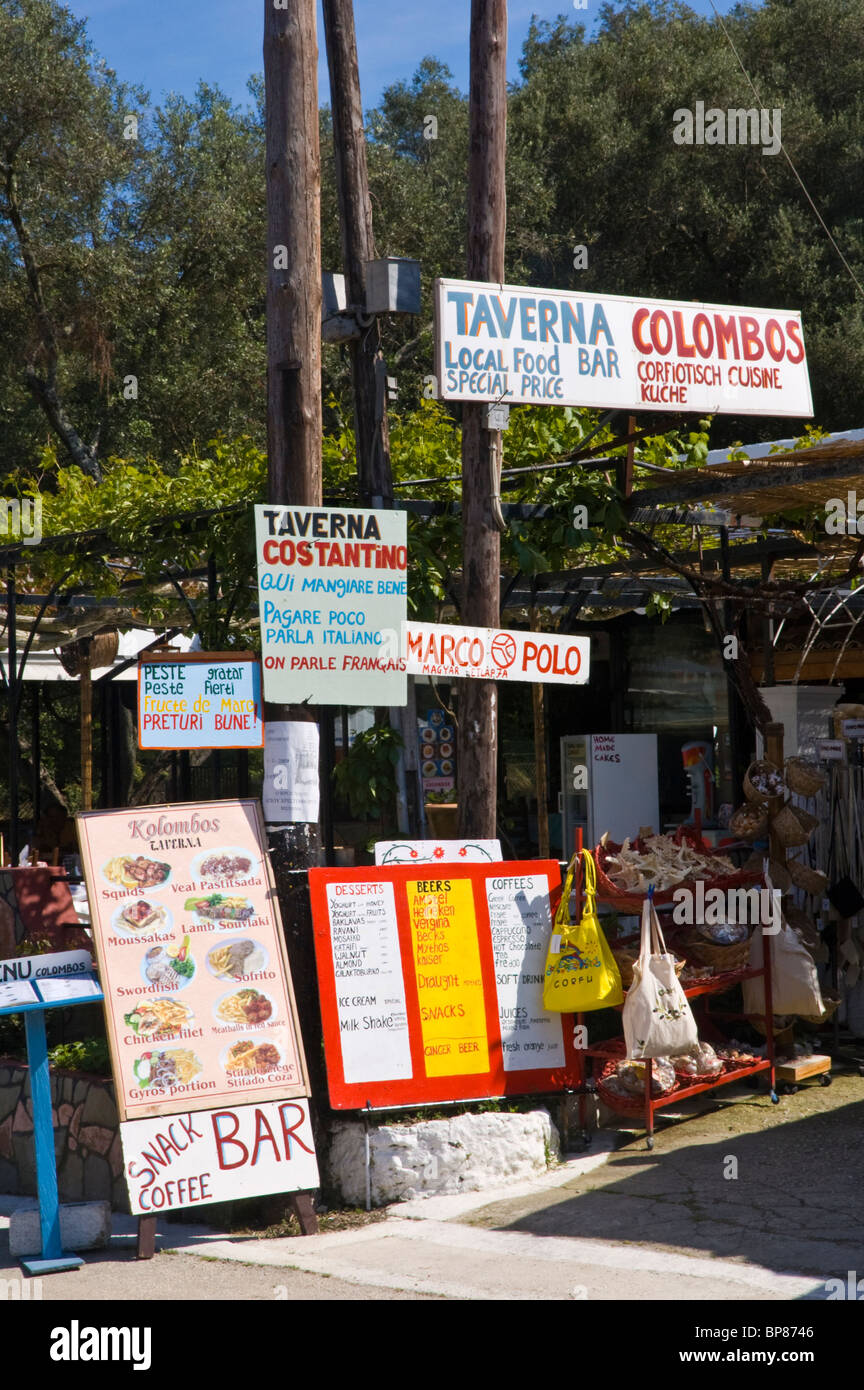 Signs outside tavernas in the mountain village of Makrades on the Greek ...