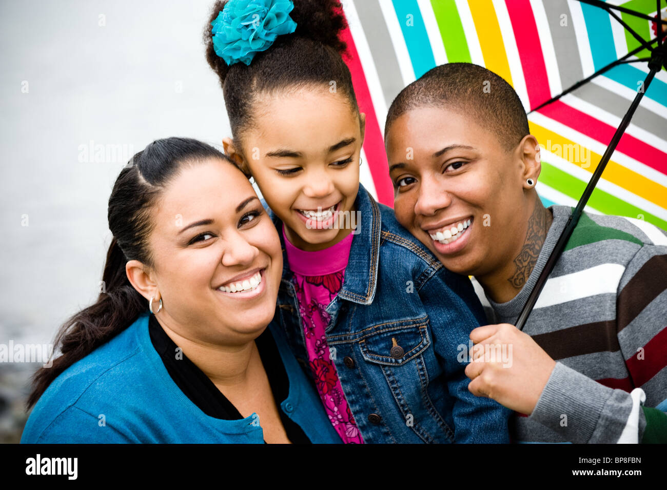 Lesbian couple with a child Stock Photo - Alamy