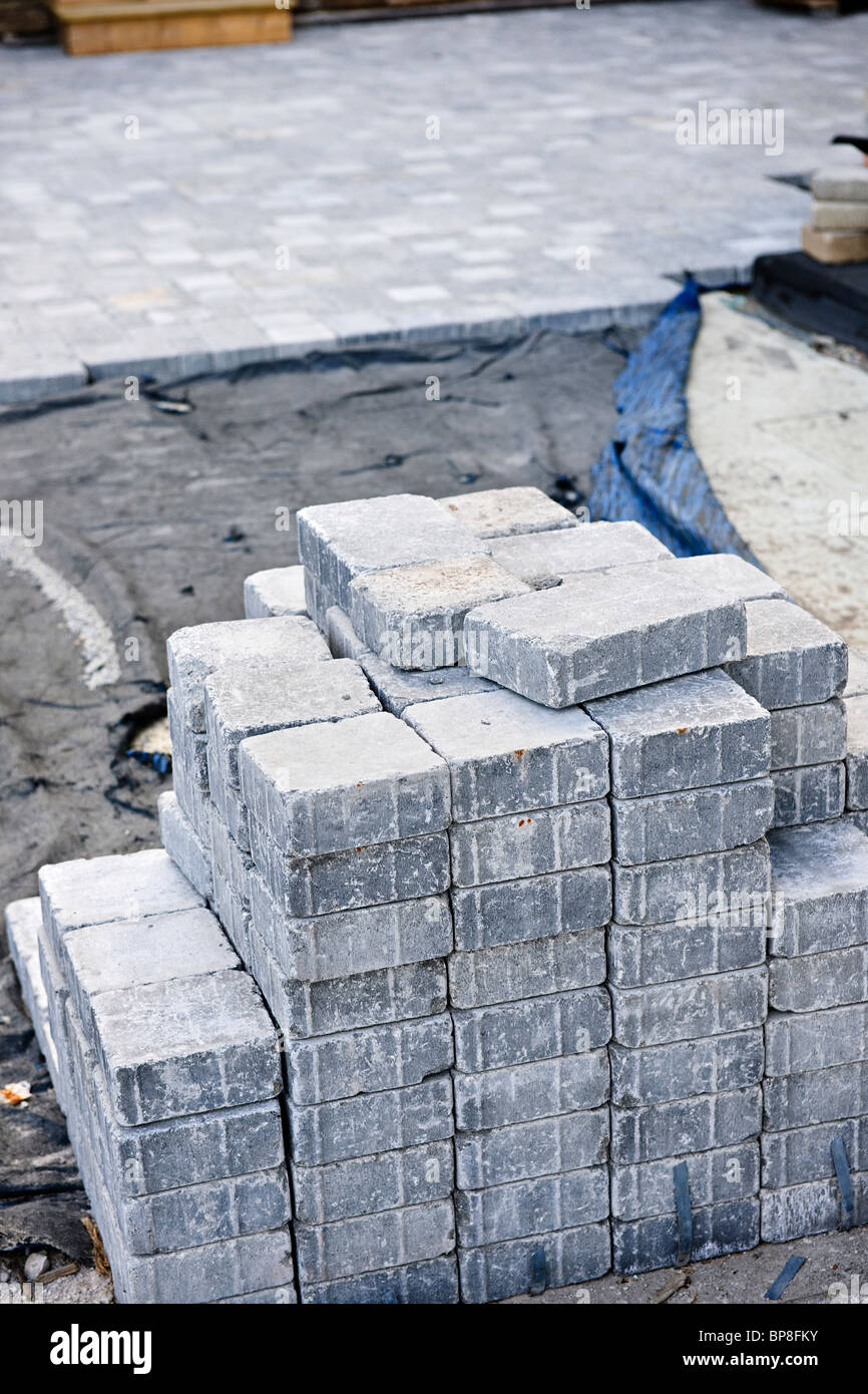 Stacks of interlocking stones for installing driveway landscaping Stock ...
