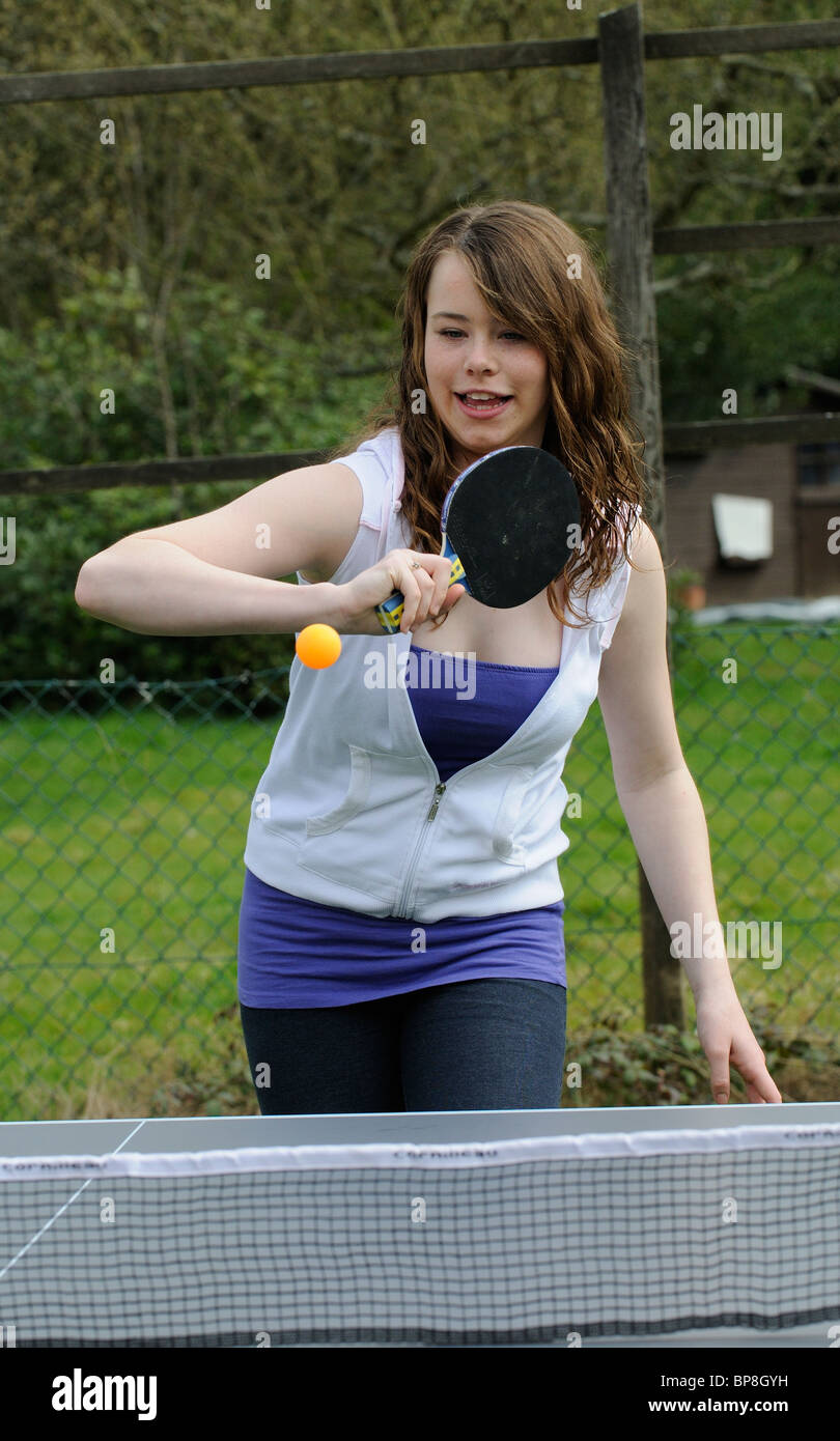 Teenage girl playing table tennis Stock Photo - Alamy