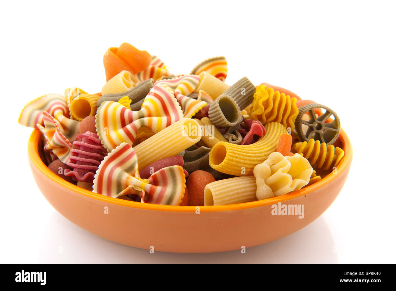 Colorful funny striped pasta isolated over white Stock Photo - Alamy