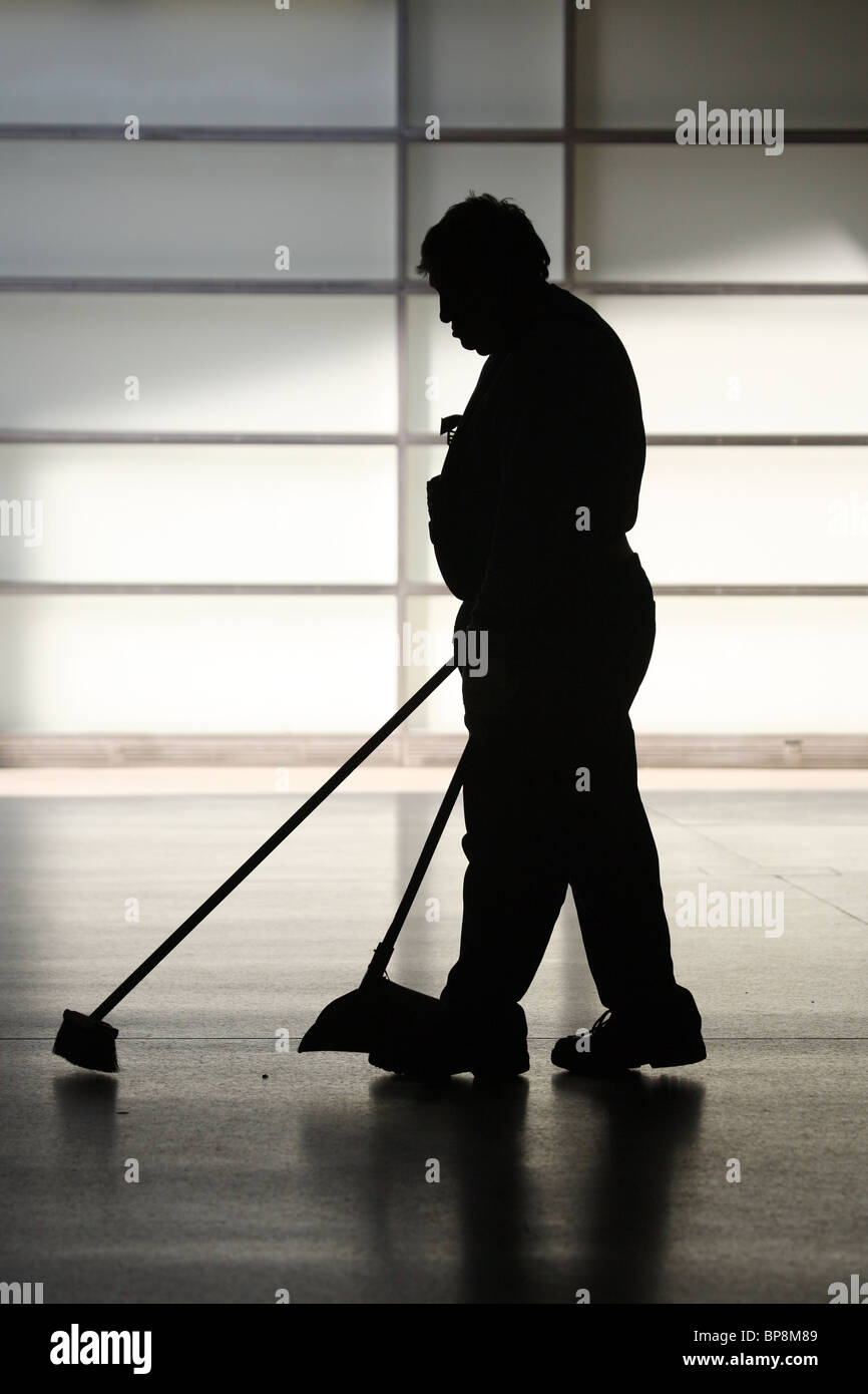 Silhouette of a cleaner Stock Photo - Alamy