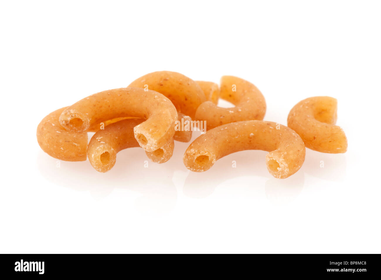 Healthy brown whole meal macaroni pasta in close up Stock Photo - Alamy