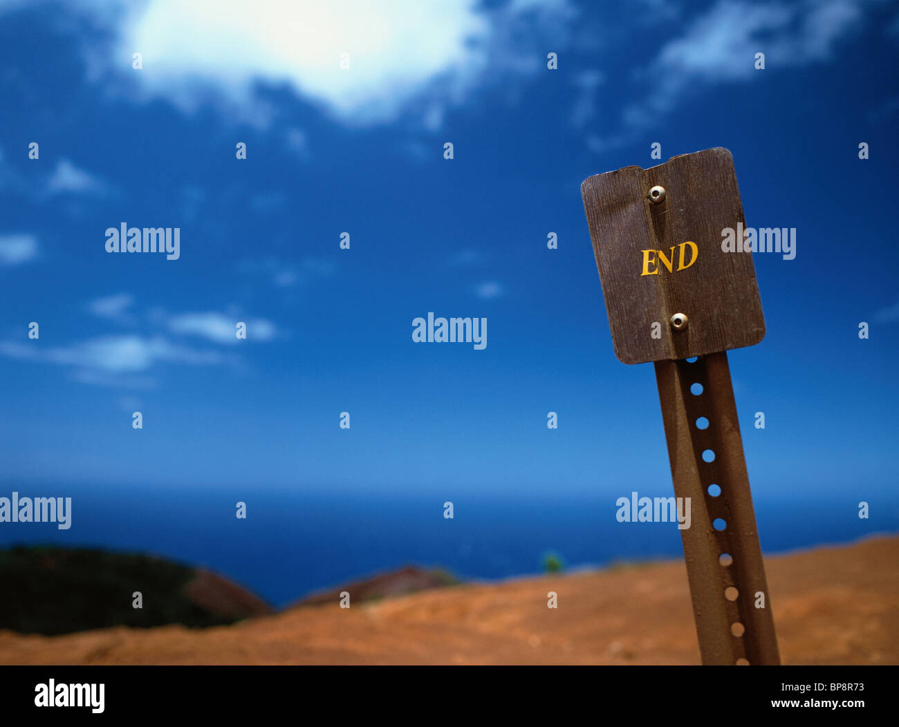 End Sign by a Cliff Stock Photo - Alamy