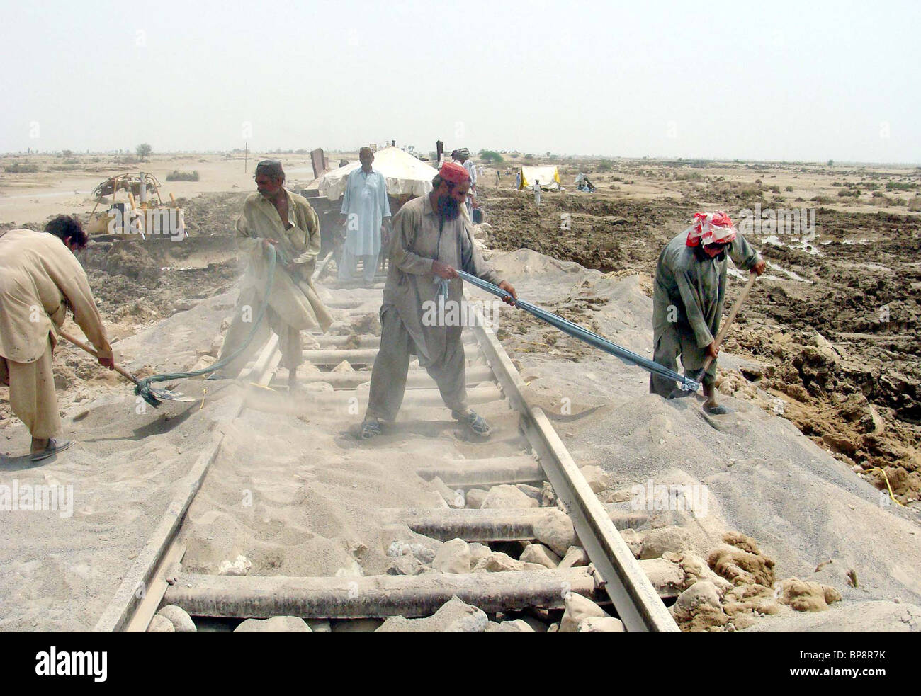 Railways employees repair of damaged railway track, which was damaged ...