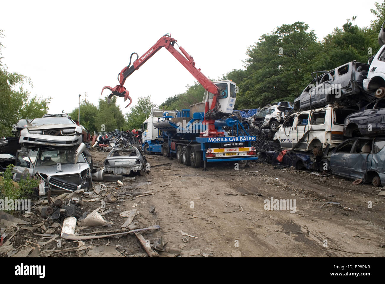 Cars being recycled in a scrapyard Stock Photo - Alamy