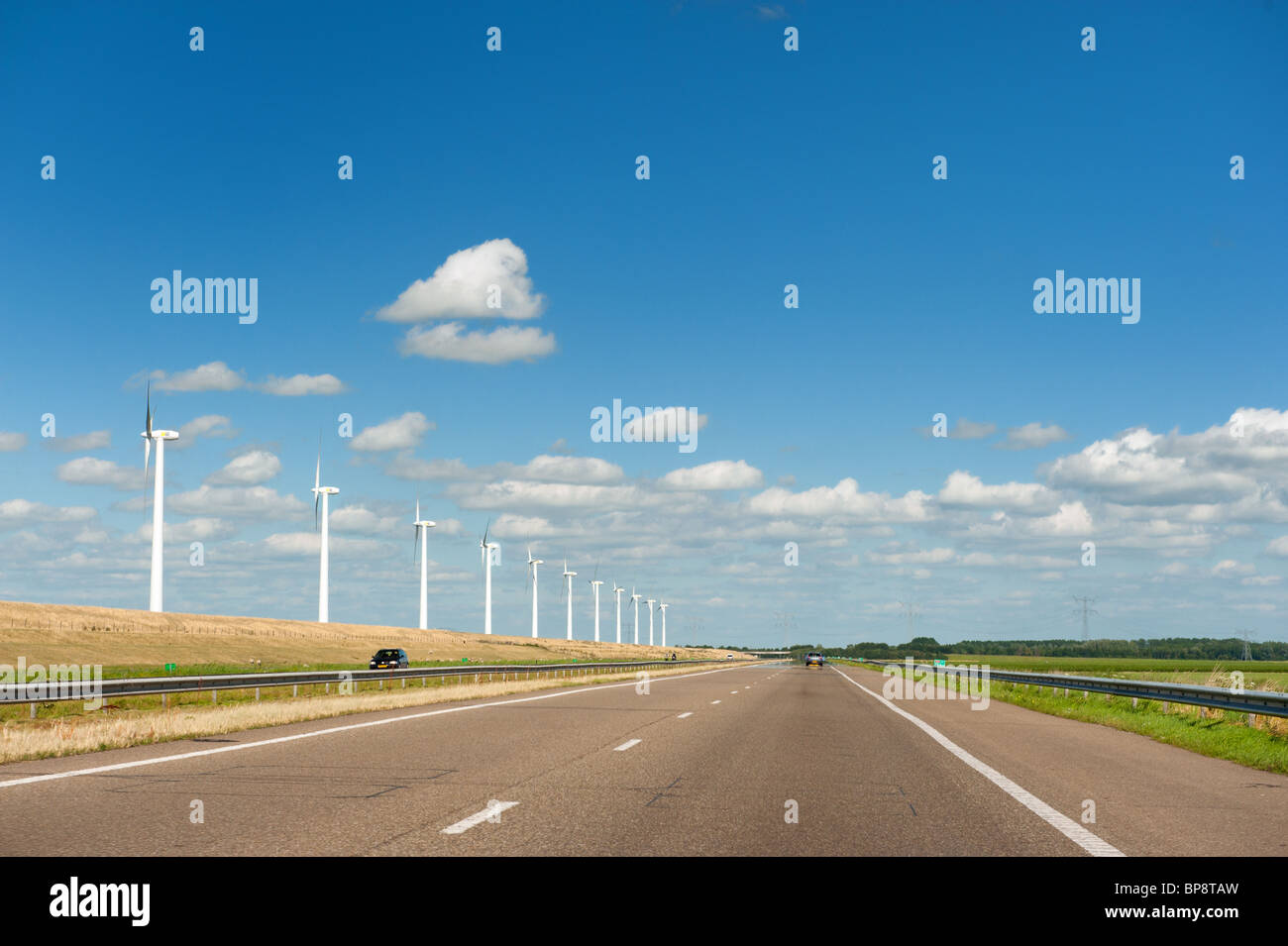 Wind turbines highway cars hi-res stock photography and images - Alamy