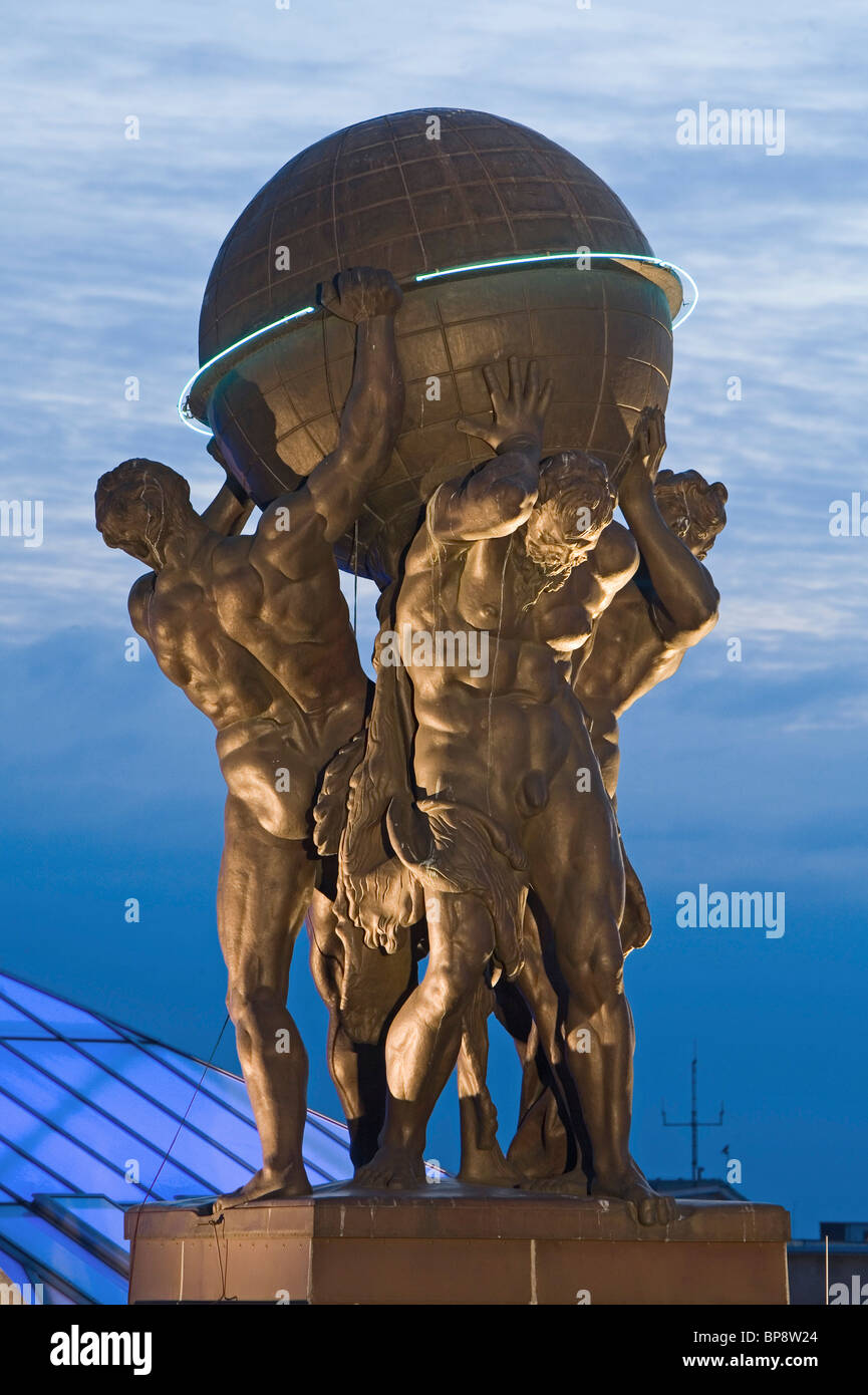Atlas figures on roof of Museum for Communication at night, Berlin ...