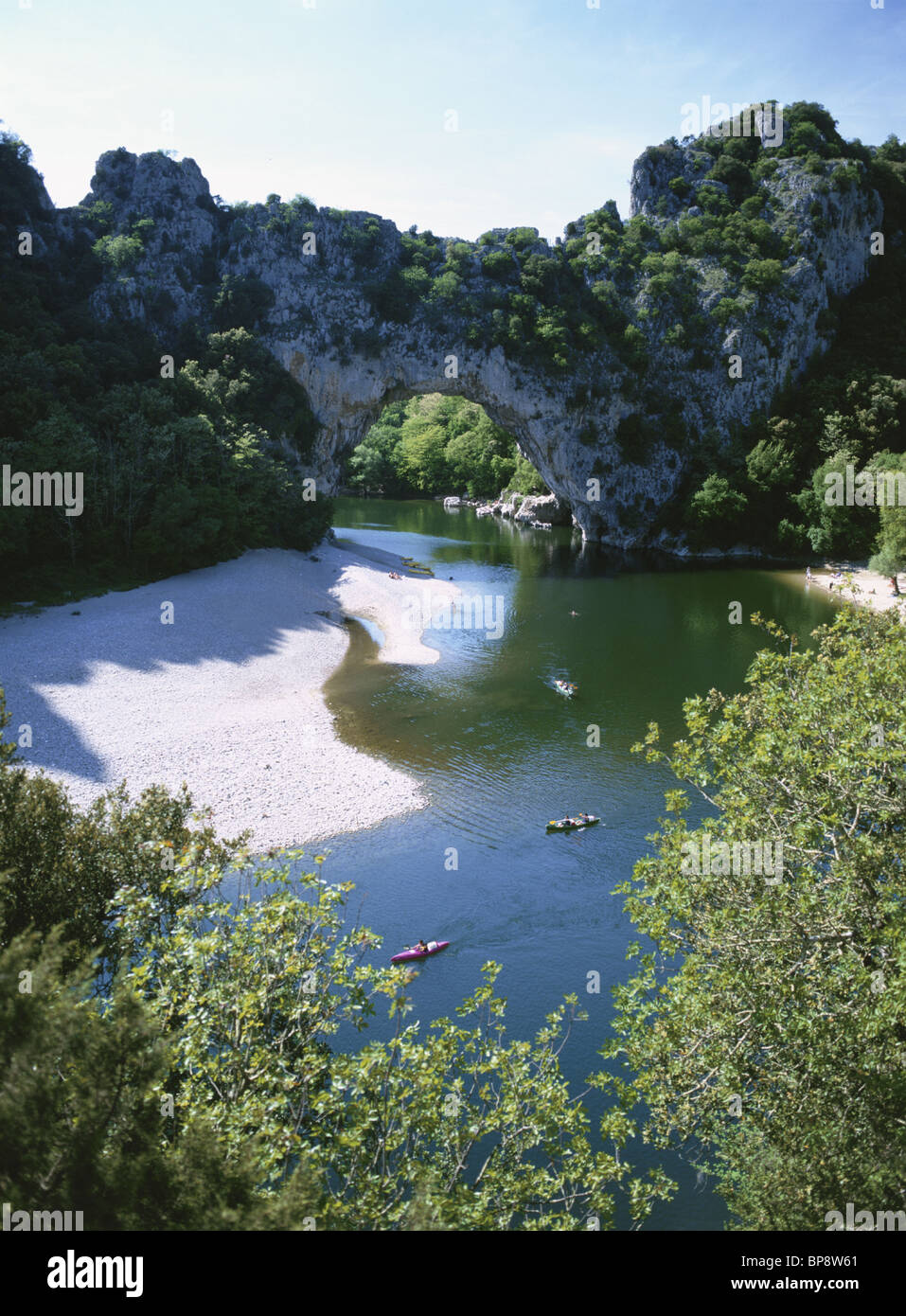 Arch Shaped Rock Formation Over a River, and Kayakers Below. France ...