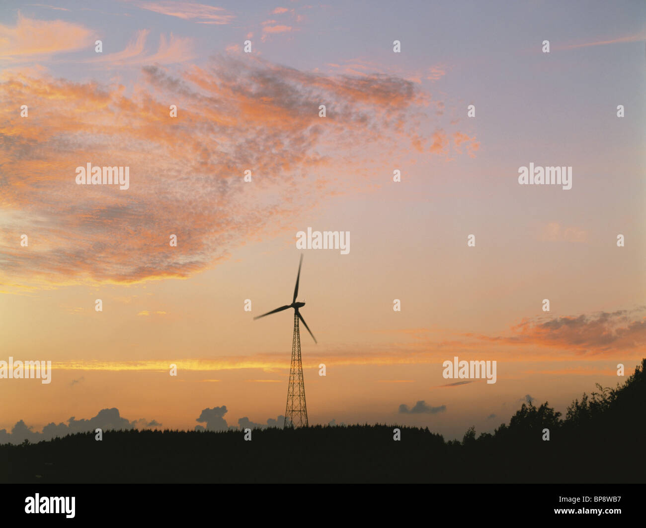 Romantic Sunset and a Wind Turbine Silhouette Stock Photo - Alamy