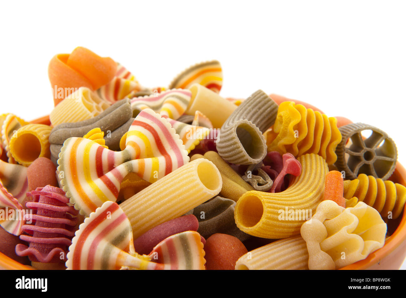 Colorful funny striped pasta isolated over white Stock Photo - Alamy