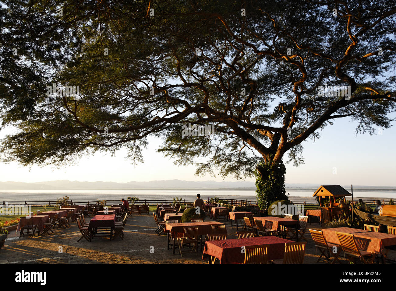 Restaurant Next to River at Sunset, Bagan, Myanmar Stock Photo - Alamy