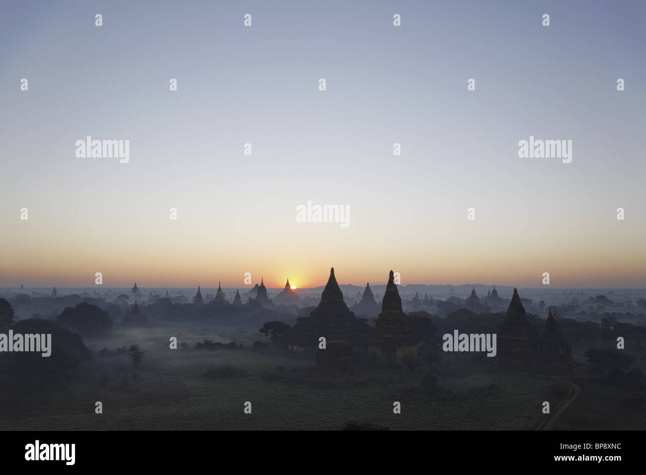 The Sun Rising Over the Silhouettes of Ancient Ruins. Bagan, Myanmar ...