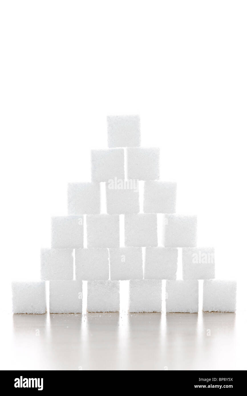 Pyramid of white sugar cubes stacked up on white background Stock Photo ...