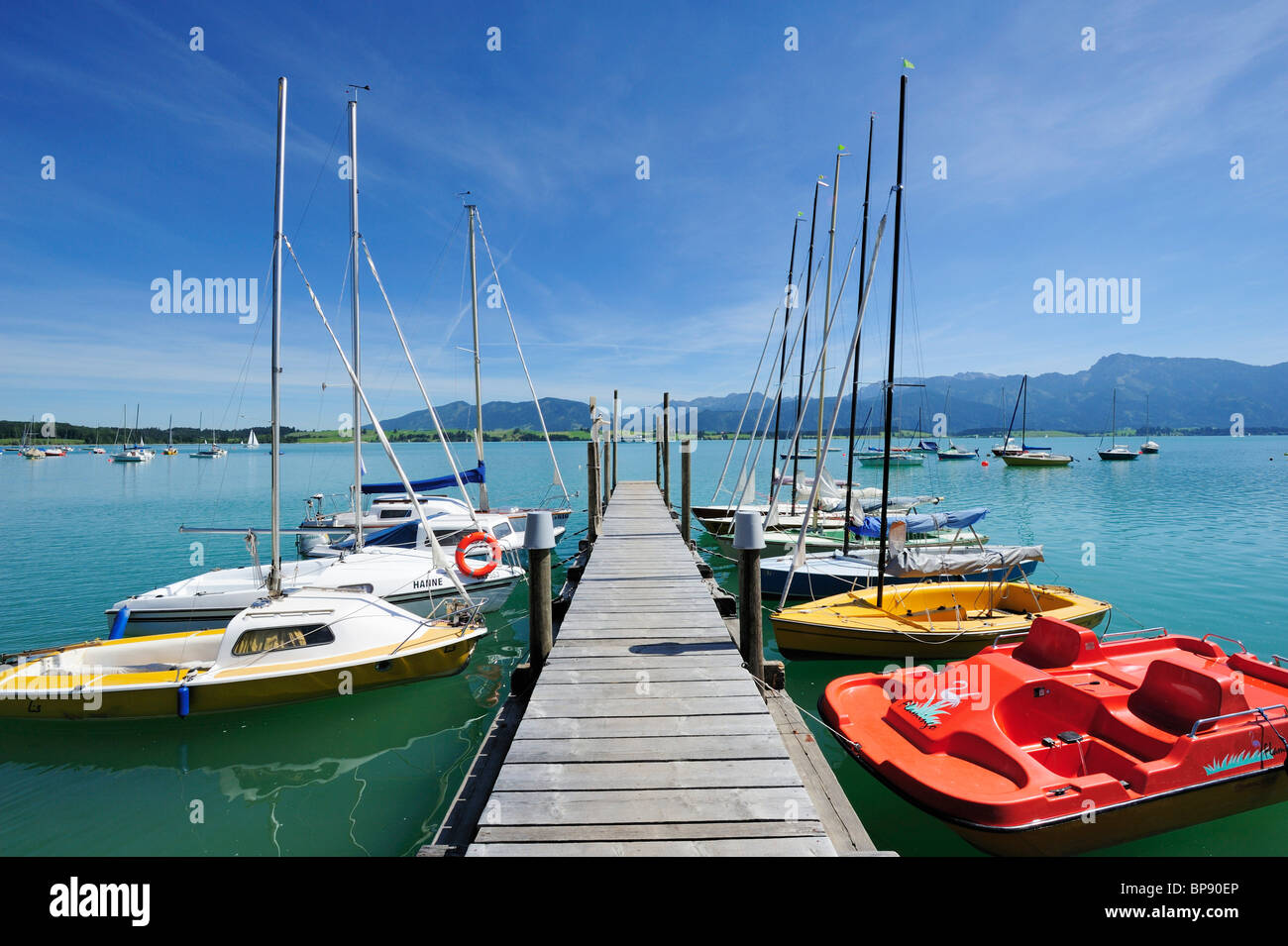 Landing stage with boats, lake Forggensee, Ammergau Alps, East Allgaeu ...