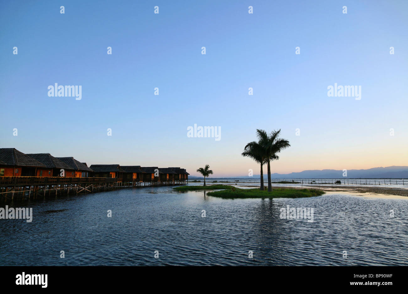 Resort on Water's Edge With Palm Tree on Grassy Island, Myanmar Stock ...