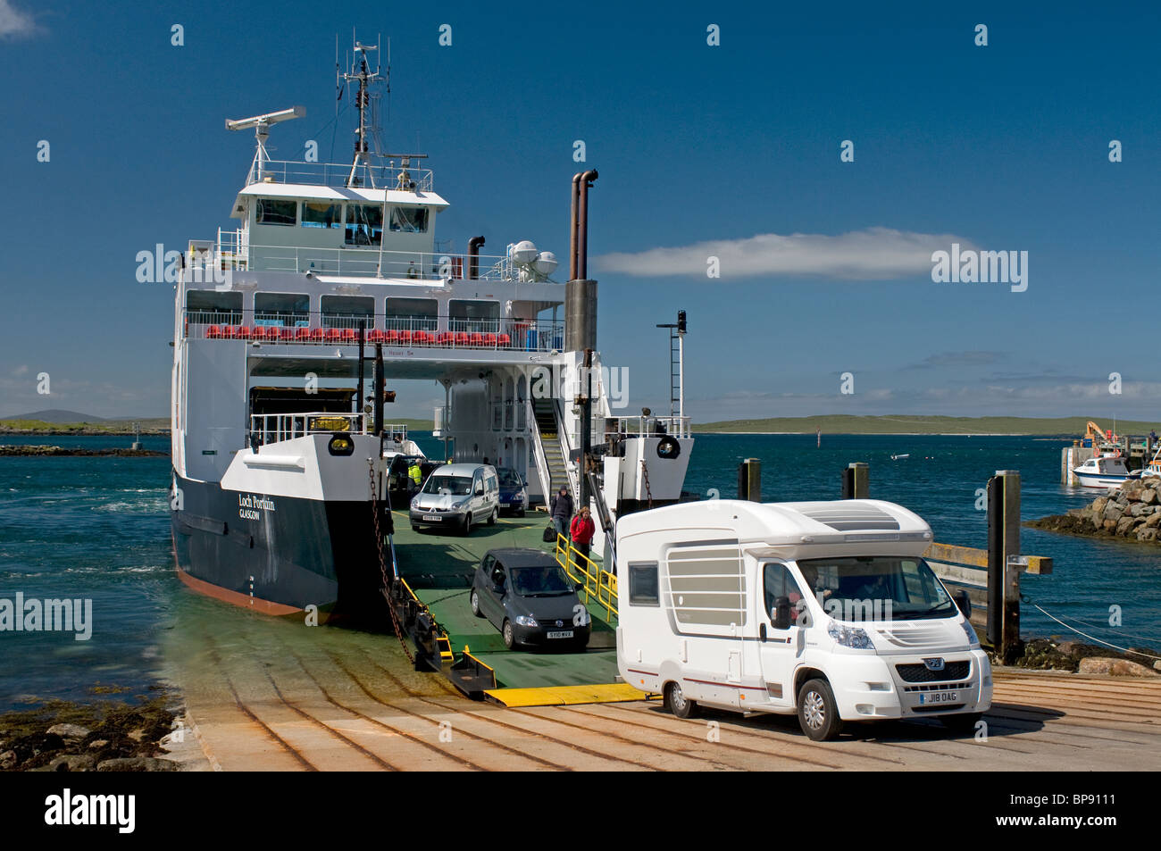 The MV Loch Portain offloading its passengers and vehicles at ...