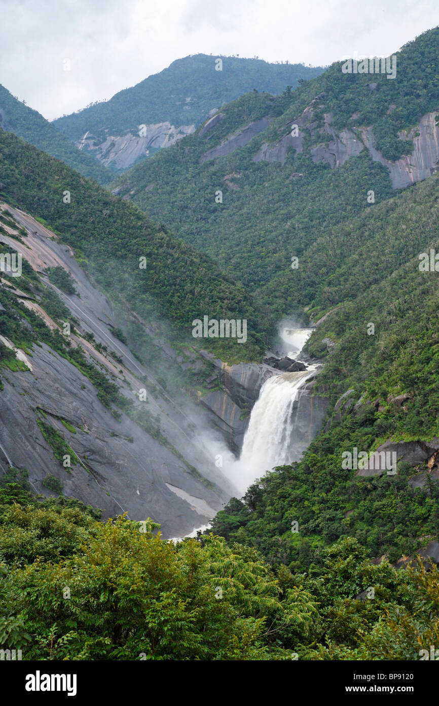 A Majestic Waterfall Flowing Down Tree Covered Cliffs. Kagoshima ...