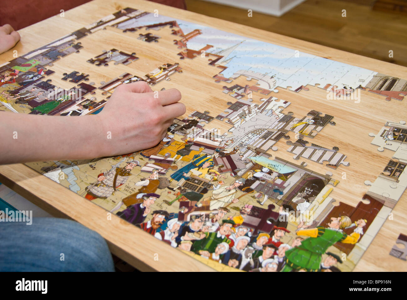 Person playing with jigsaw Stock Photo - Alamy