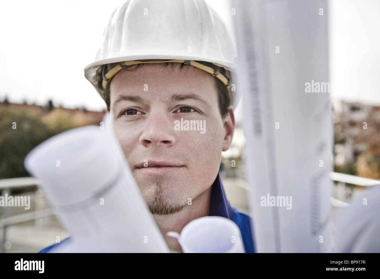 Construction worker with plans, Munich, Bavaria, Germany Stock Photo ...