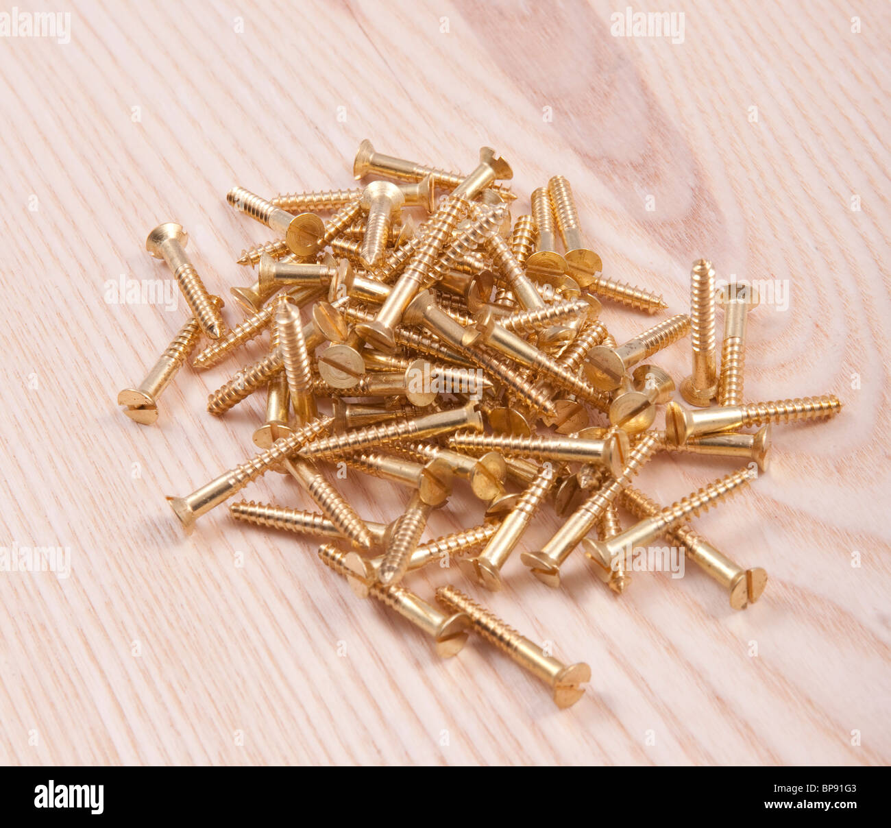Brass wood screws on ash plank. Screws are countersunk. Note ...