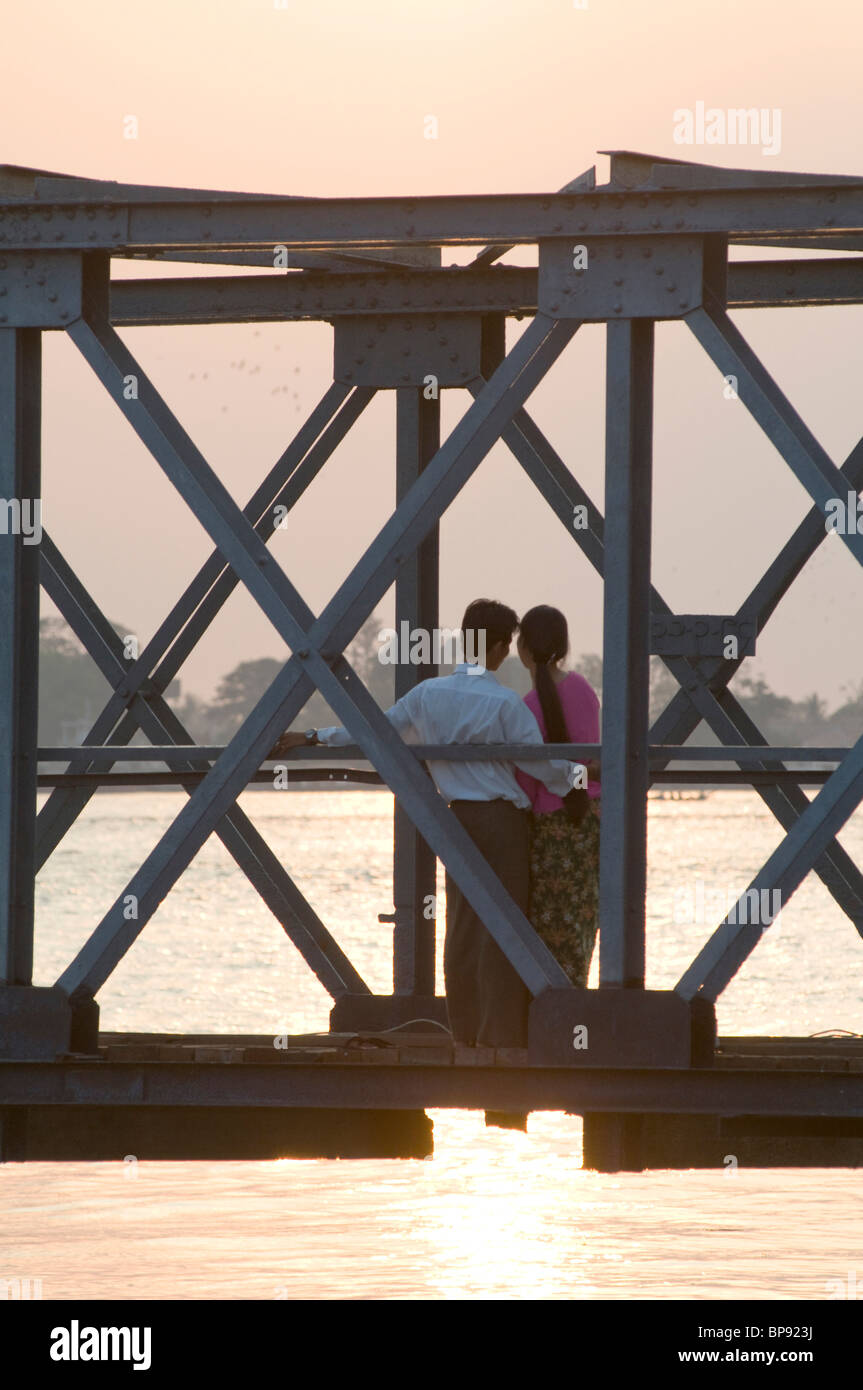 MYANMAR (BURMA) COUPLE SEEING SUNSET AT YANGON HARBOUR Photo © Julio ...